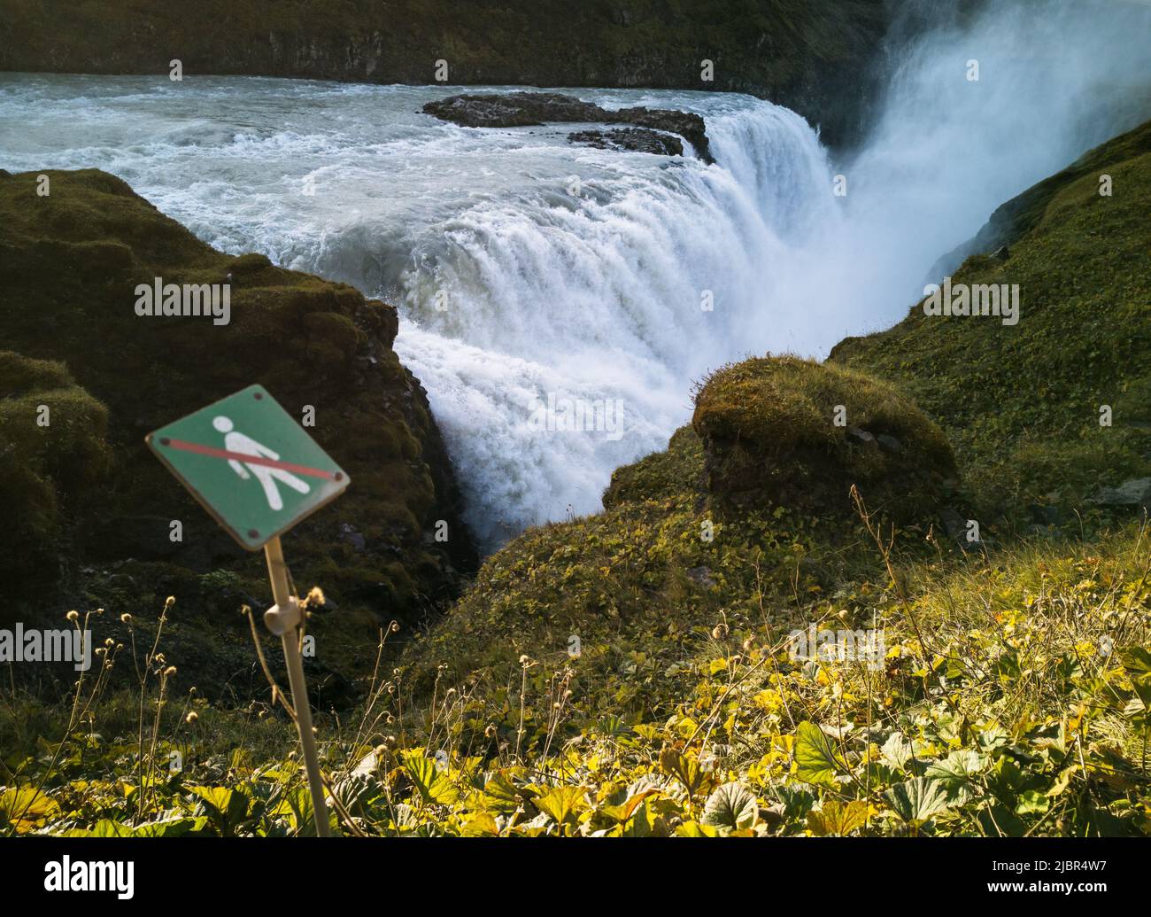 Gullfoss massive waterfall and hiking forbidden sign Stock Photo - Alamy