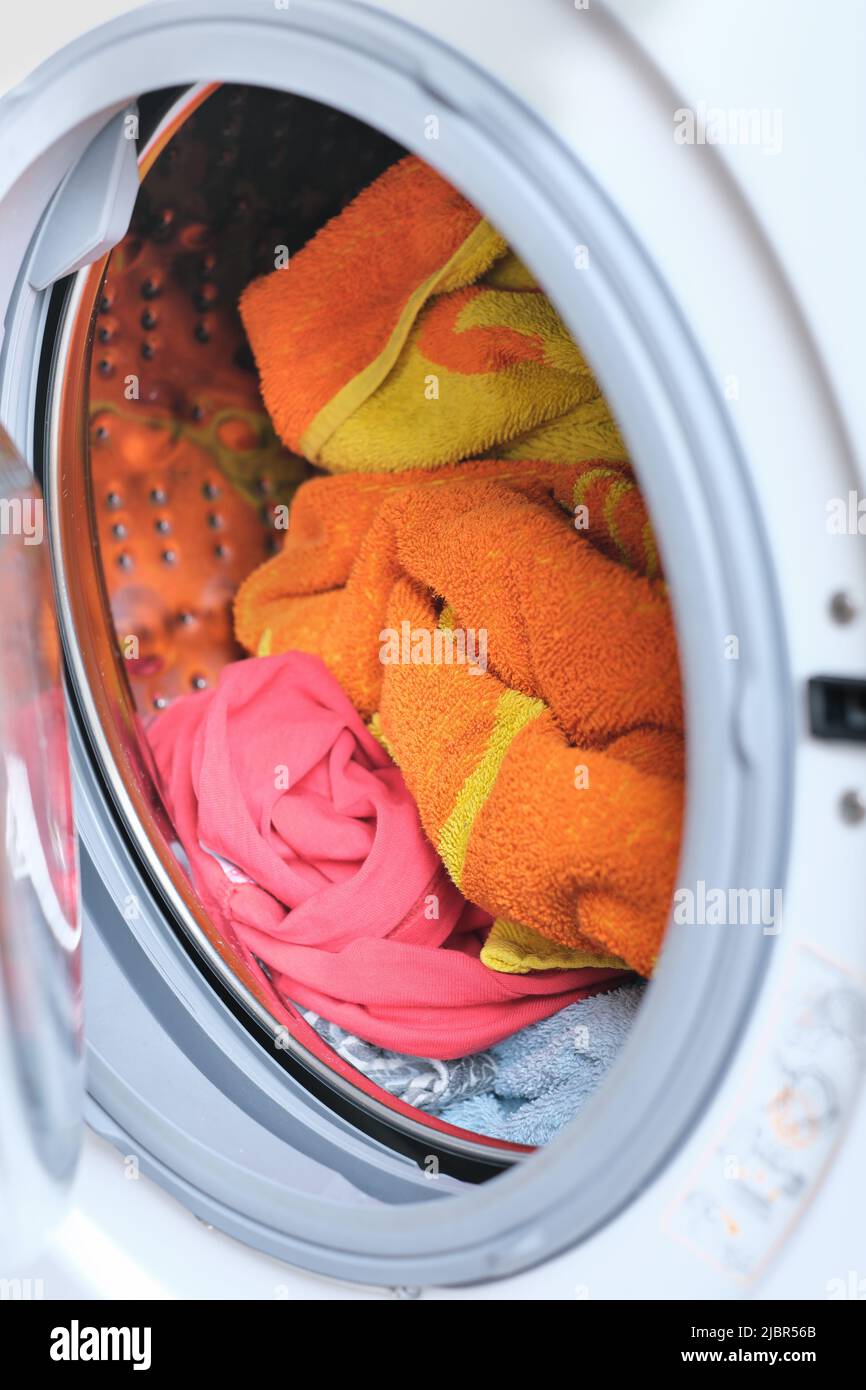 Washing Machine Filled With Laundry. housekeeping and chores and home ...