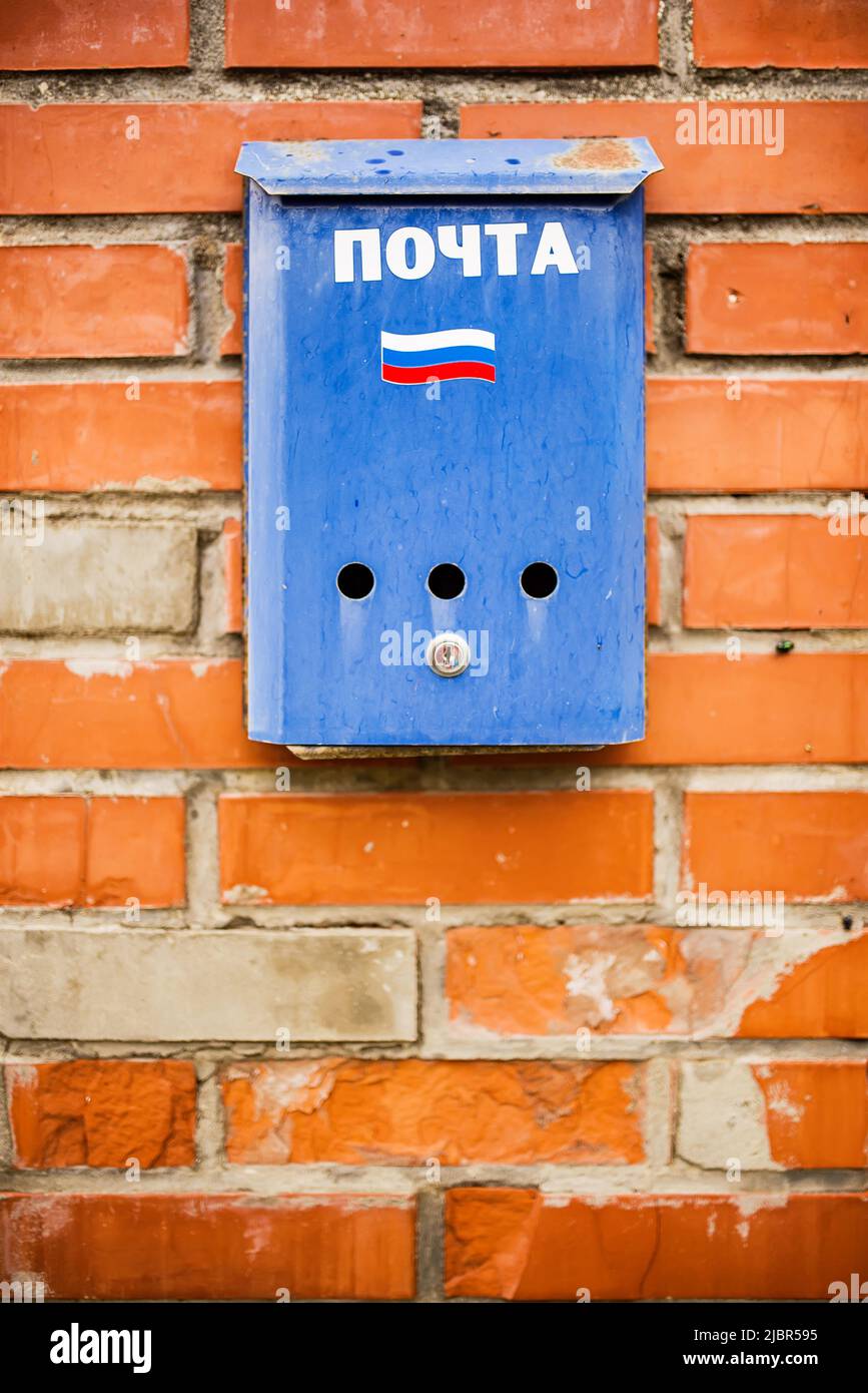 blue mailbox on a brick wall, russian post, russia flag, background ...