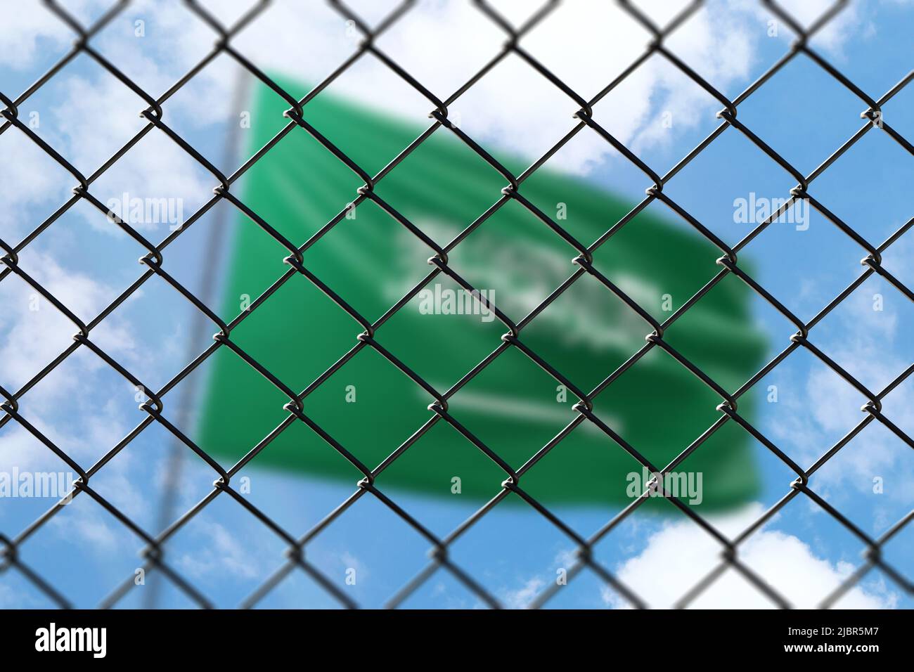 A steel mesh against the background of a blue sky and a flagpole with ...