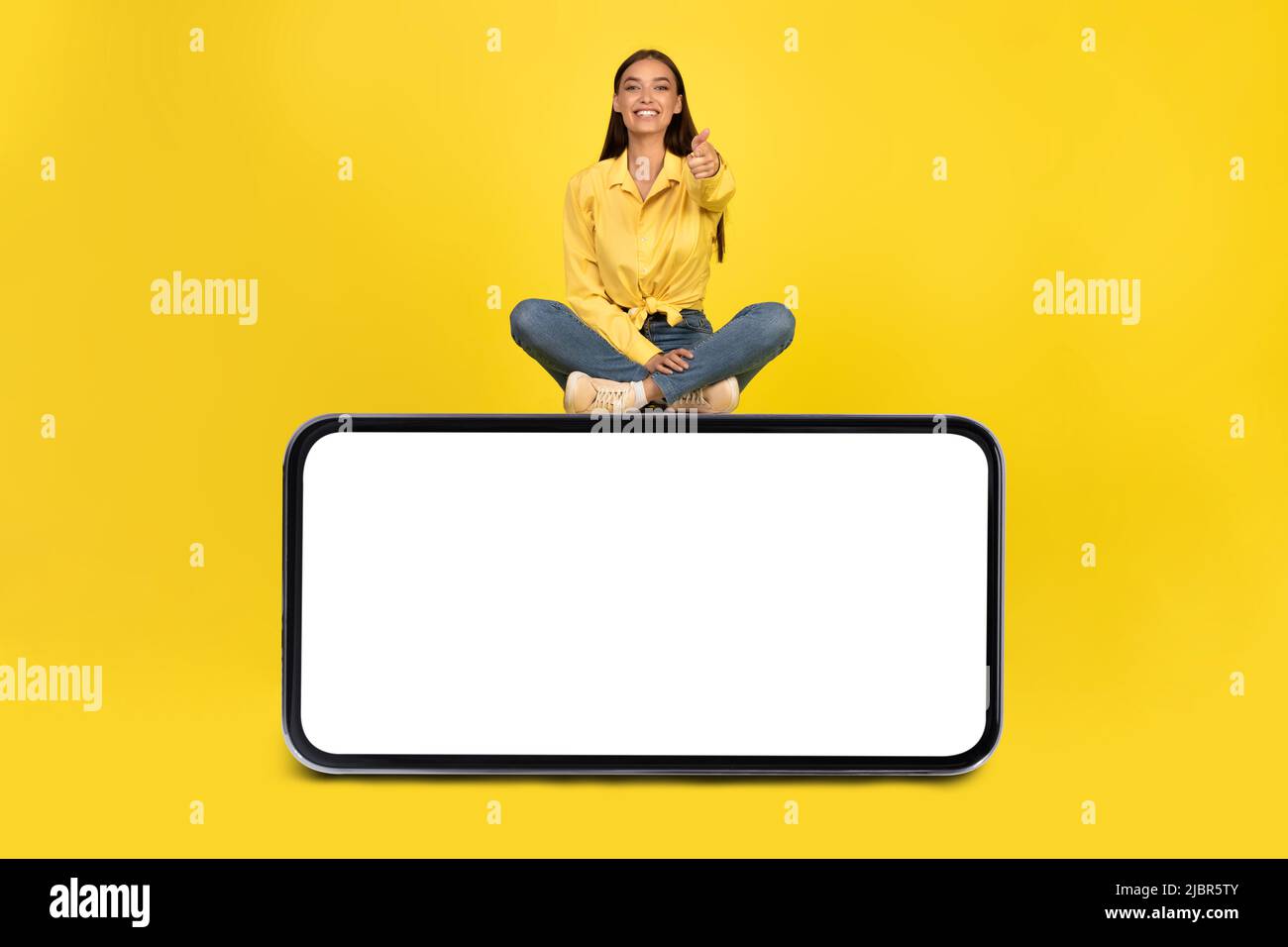 Finger pointing on phone hi-res stock photography and images - Alamy