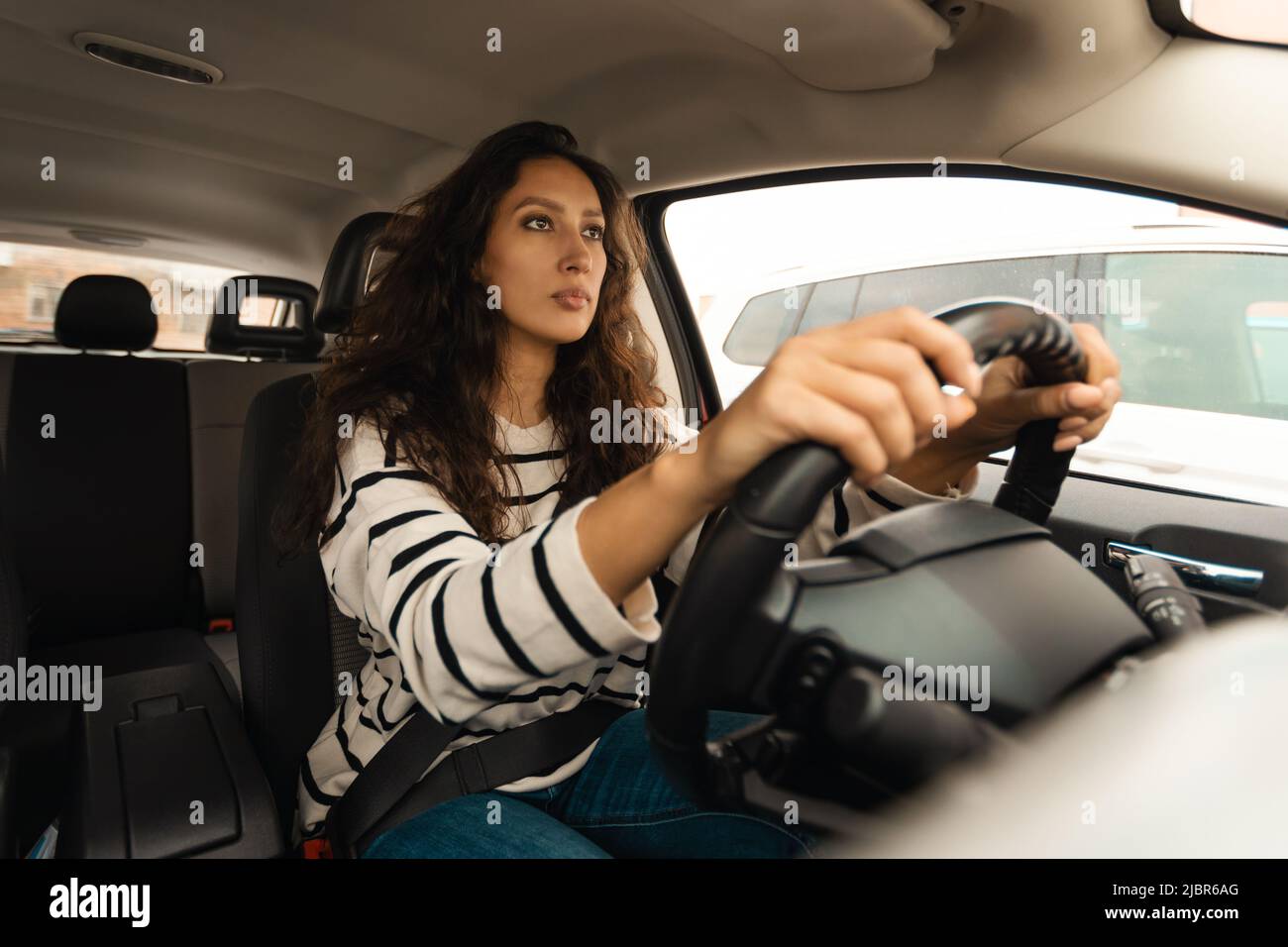 Arabic Female Driver Driving Sitting In New Car Stock Photo - Alamy