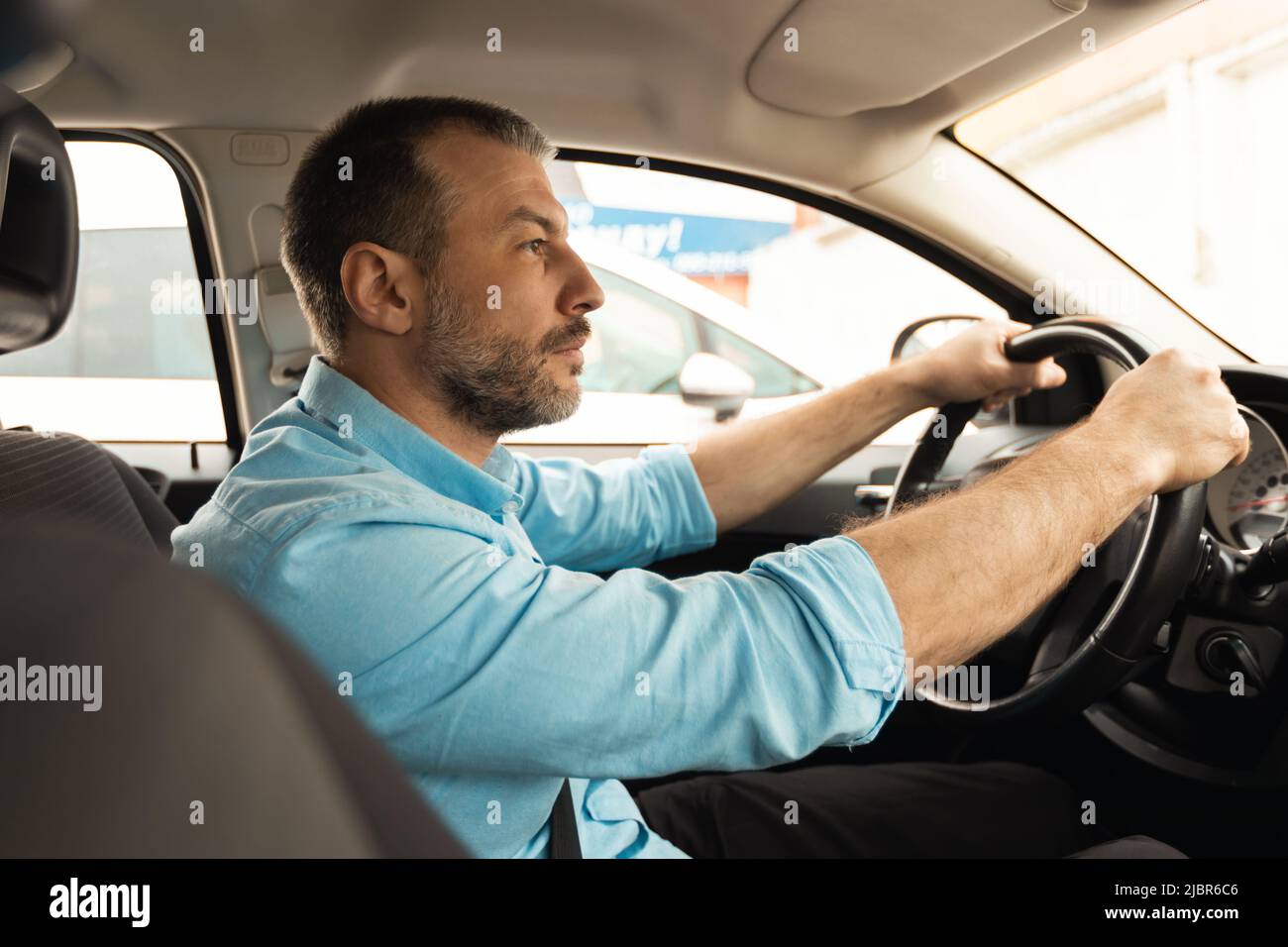 Side View Of Male Driver Driving Car Sitting Inside Auto Stock Photo ...