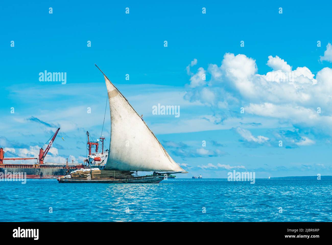 Wooden ship with timber in water of Indian ocean. Zanzibar, Tanzania ...