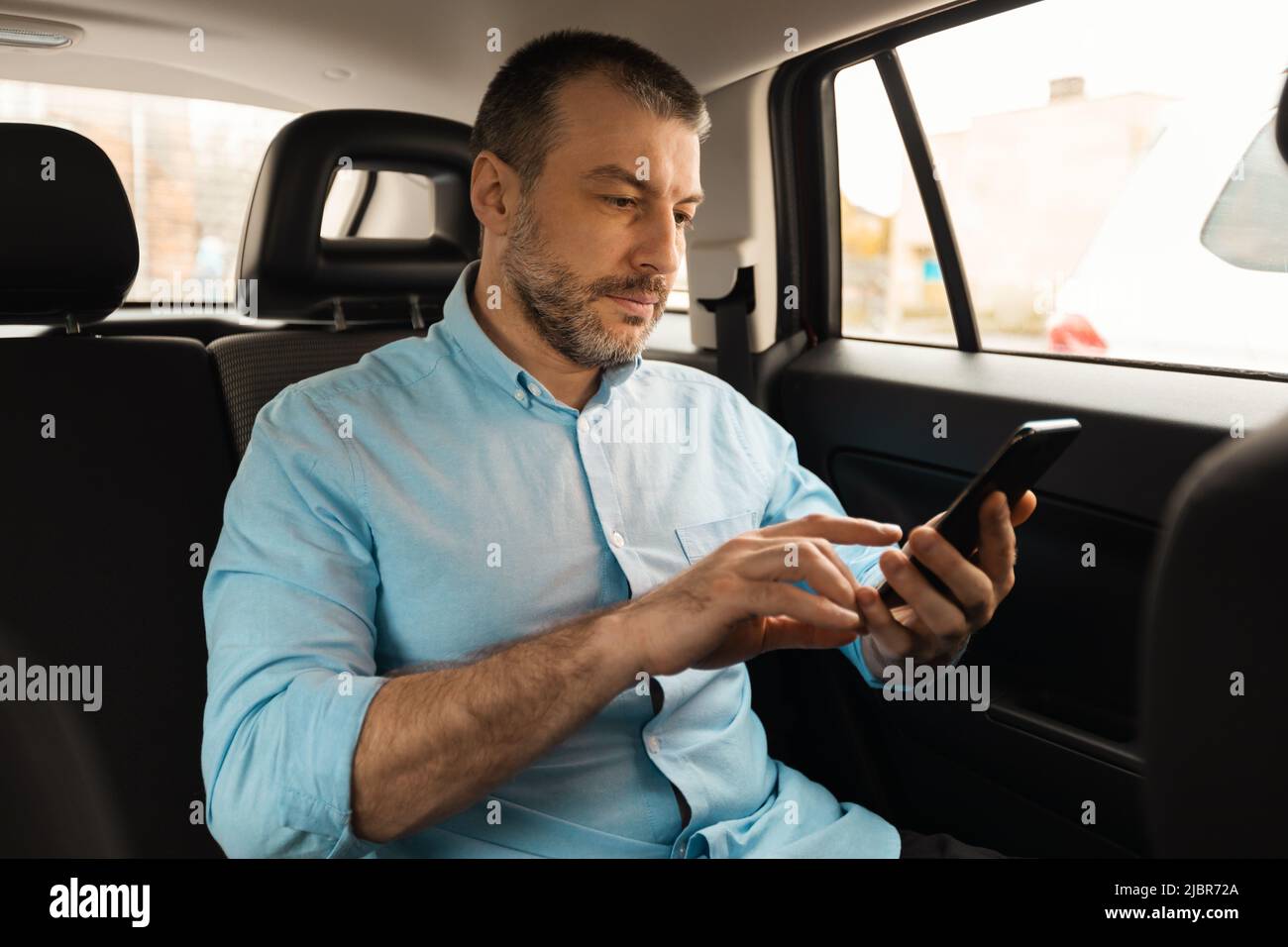 Man in passenger seat car hi-res stock photography and images - Alamy