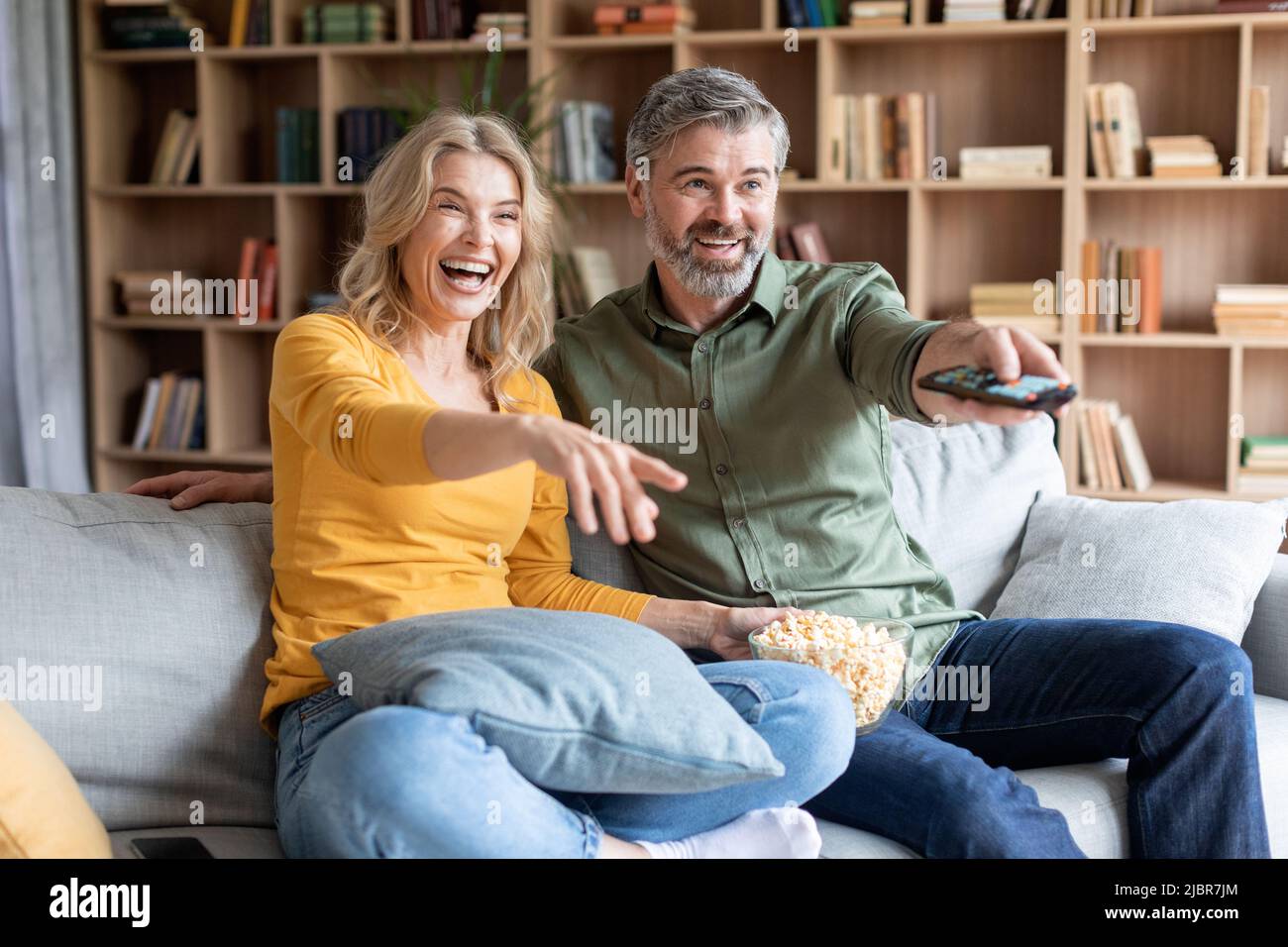 Happy people having fun watching hi-res stock photography and images - Alamy