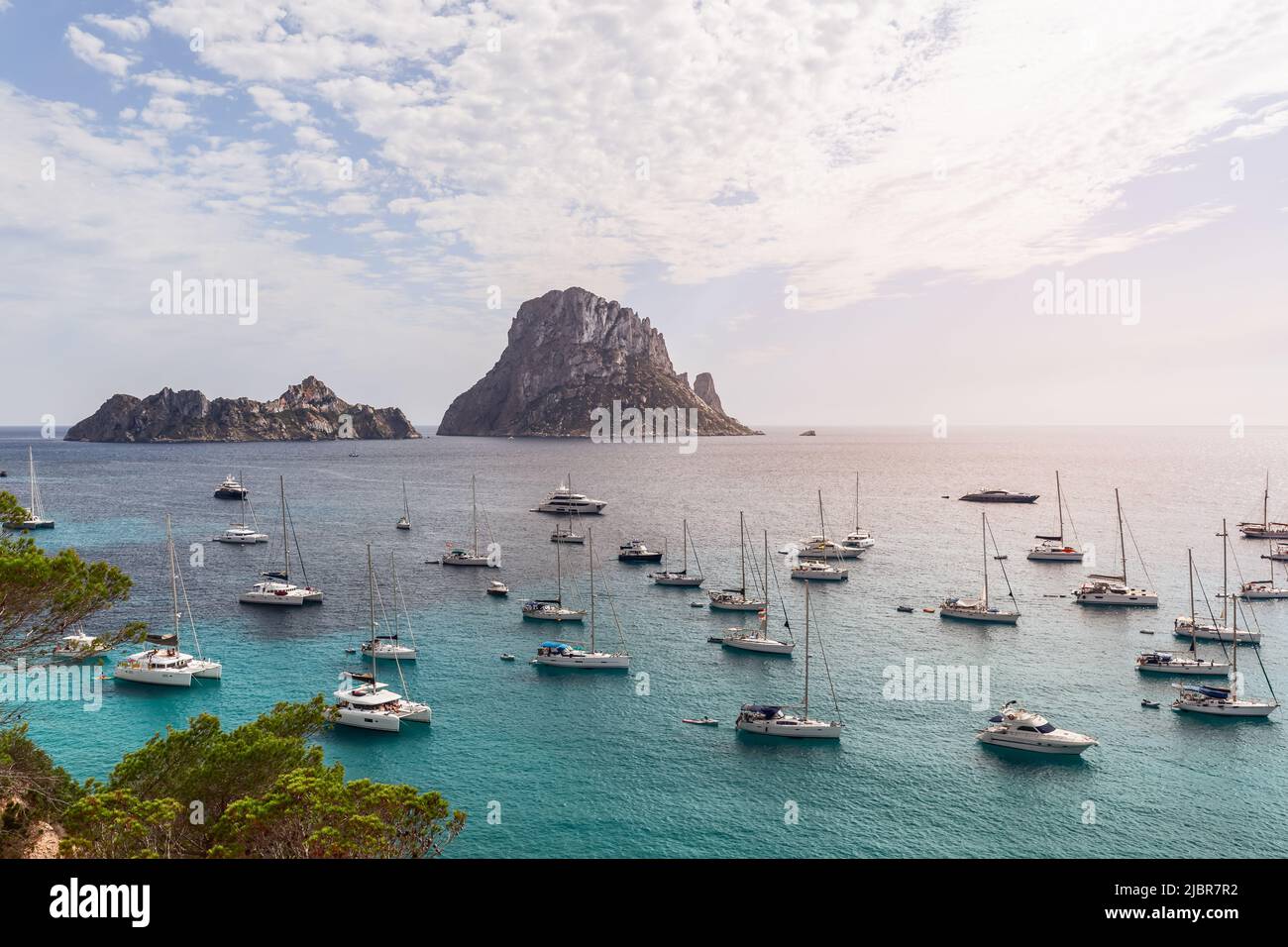 Sailing yachts and catamarans of various sizes in the bay Cola d'Hort ...