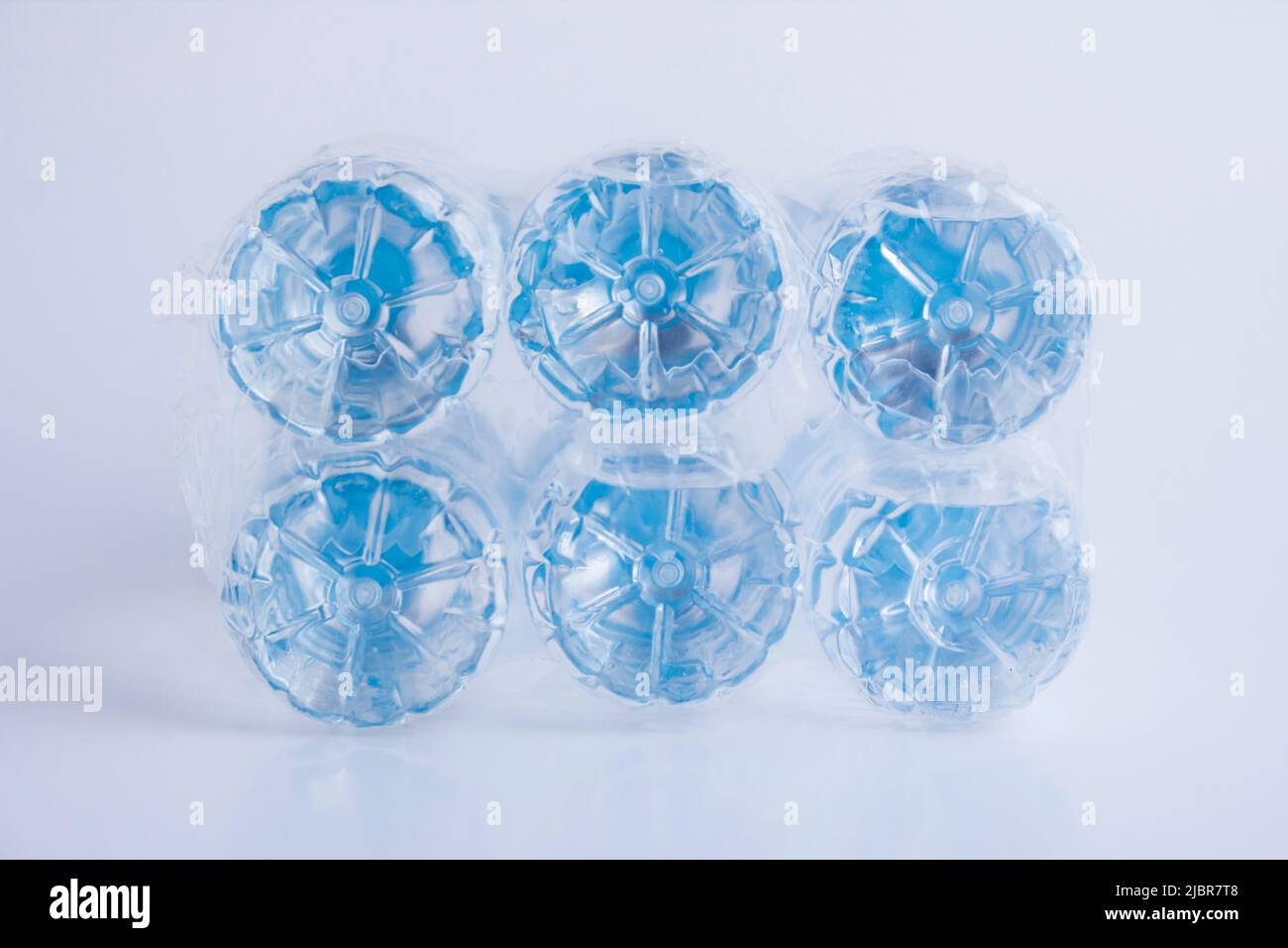 Bottom view,six small pet bottles of natural spring water in ...