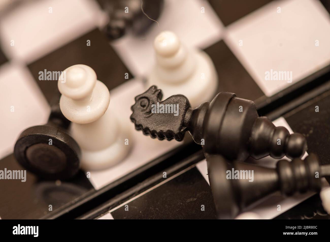 Chess pieces on a chessboard. Close-up, selective focus Stock Photo - Alamy