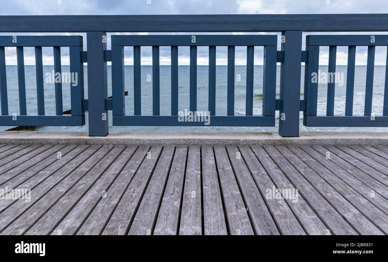 Sea embankment with railings. Wooden promenade for walking along the ...