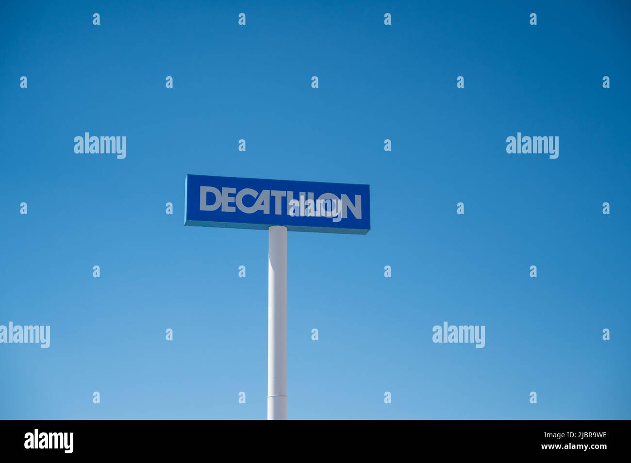 A Decathlon advertising sign against a blue sky in Spain Stock Photo ...