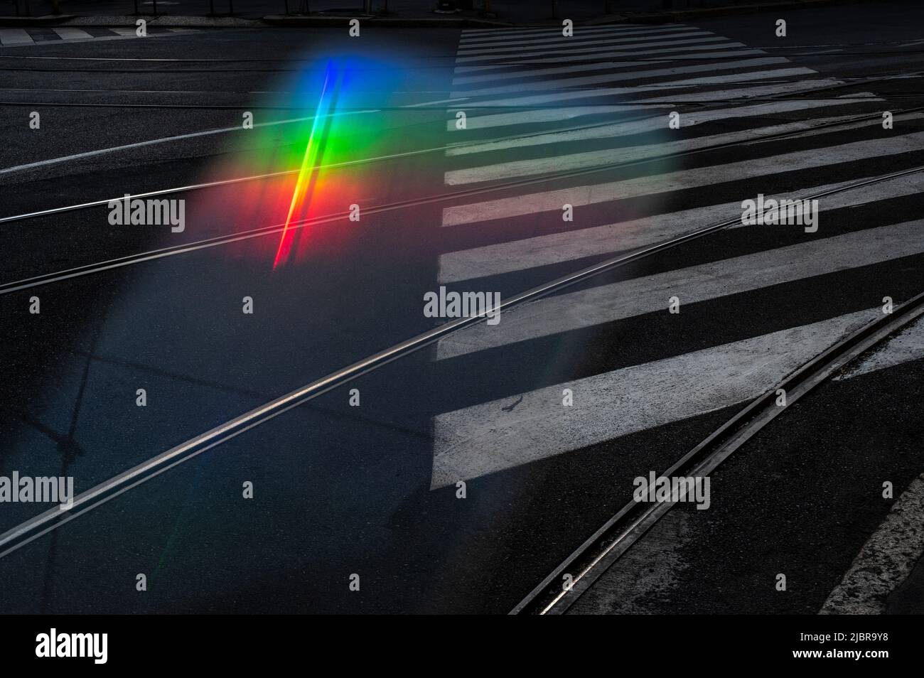 Zebra crossing and railway in the street with rainbow light Stock Photo ...