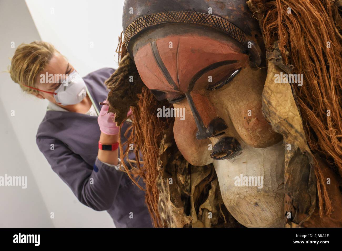 ATTENTION EDITORS: EMBARGO 08/06/2022 a Kakuungu mask is prepared for ...
