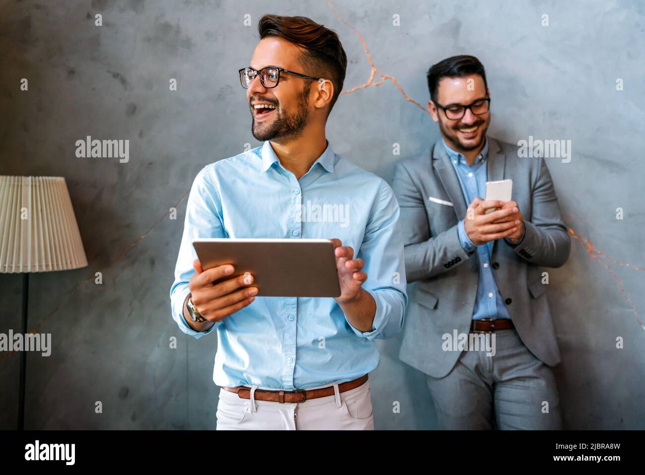 Young smiling successful business man, entrepreneur in formal business ...