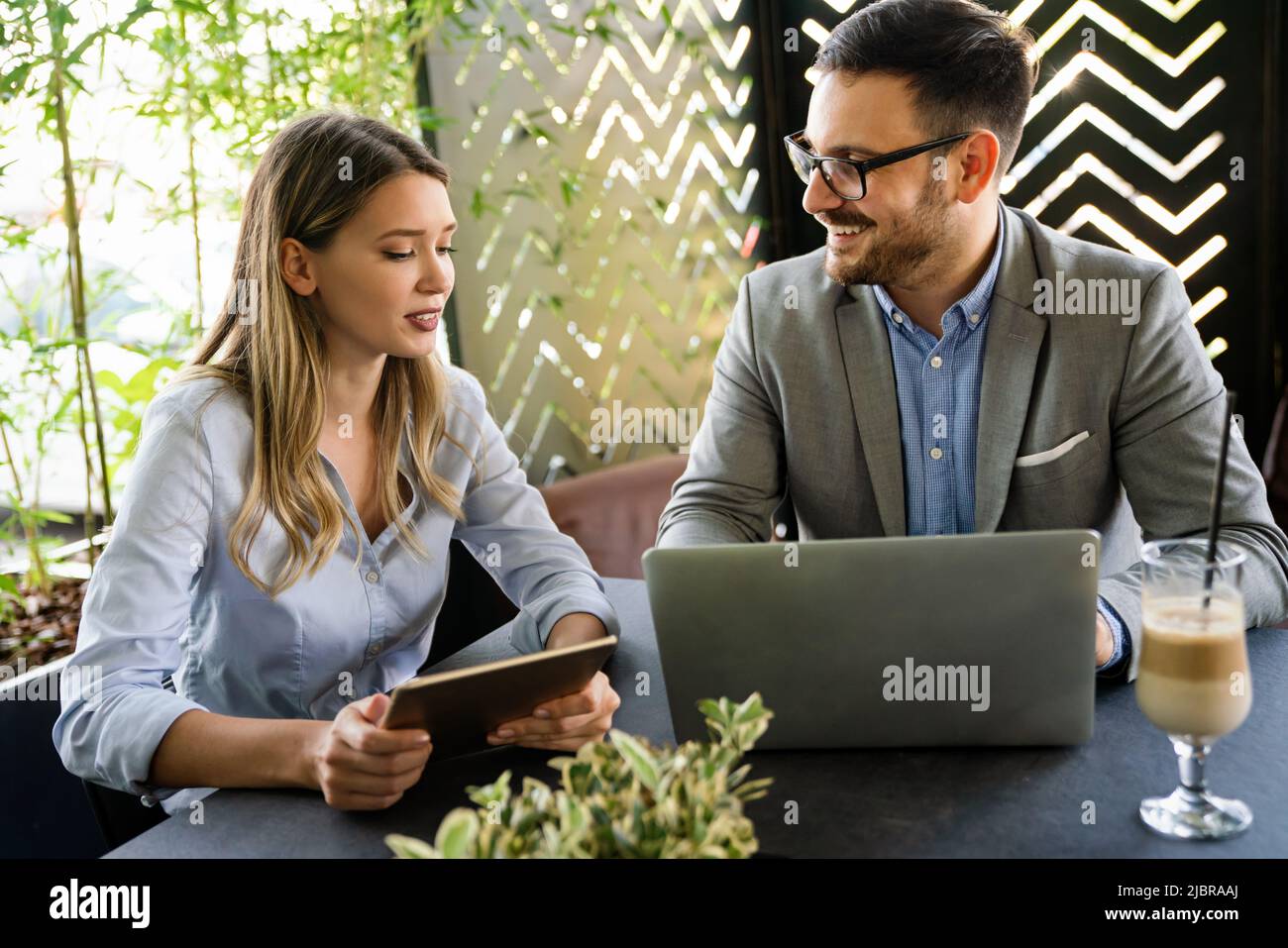 Business colleagues having conversation during coffee break Stock Photo ...