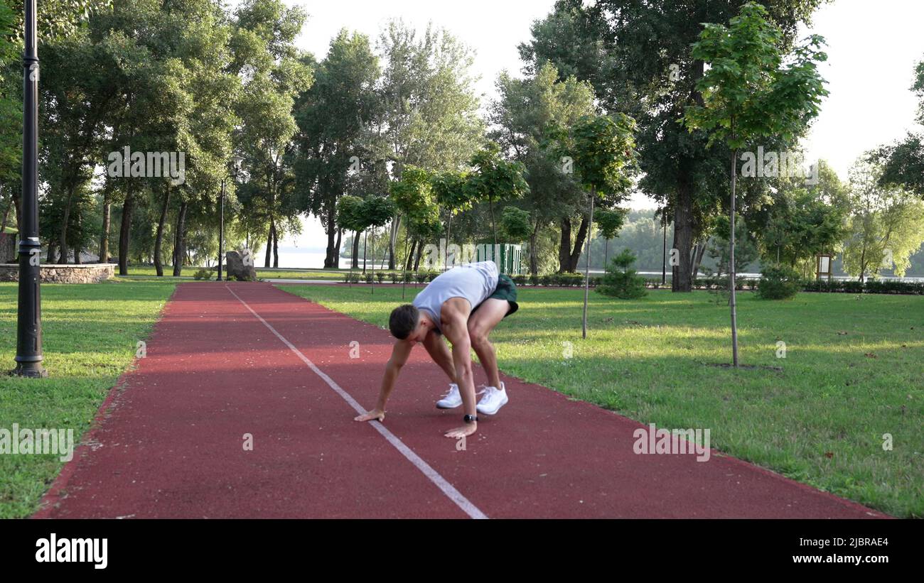 young man sportsman doing burpee exercise in park outdoor, burpee Stock ...