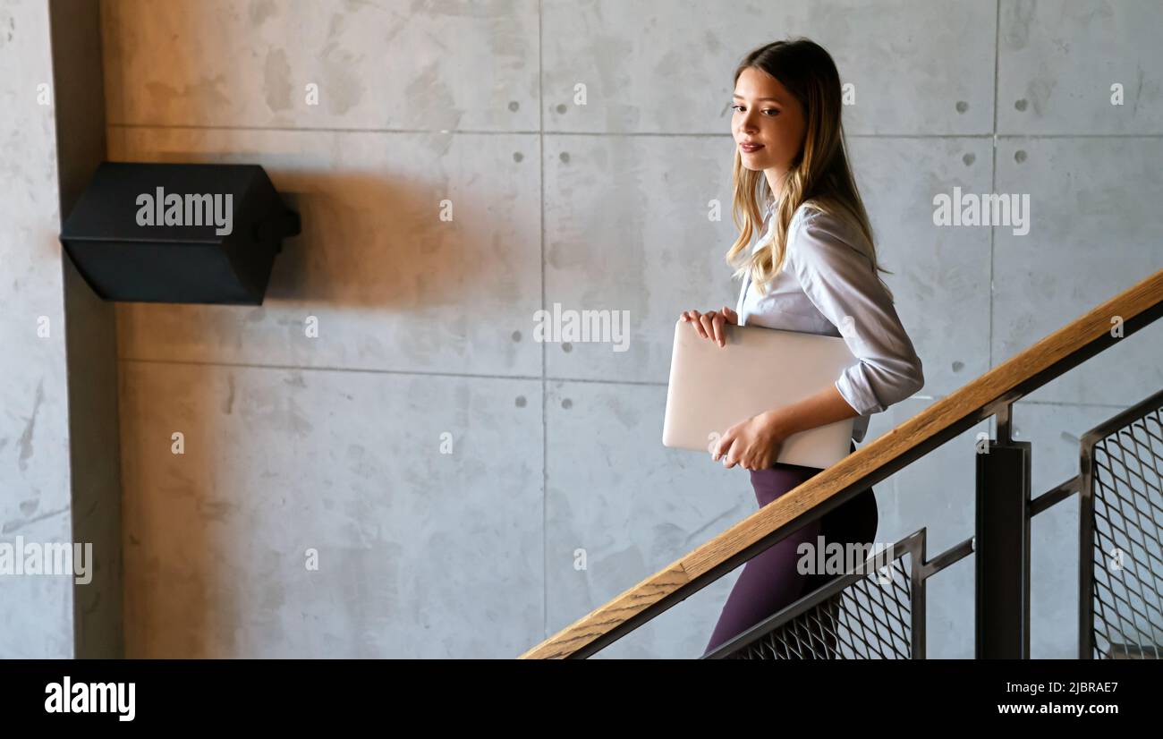 Portrait of happy beautiful successful business woman, manager working ...