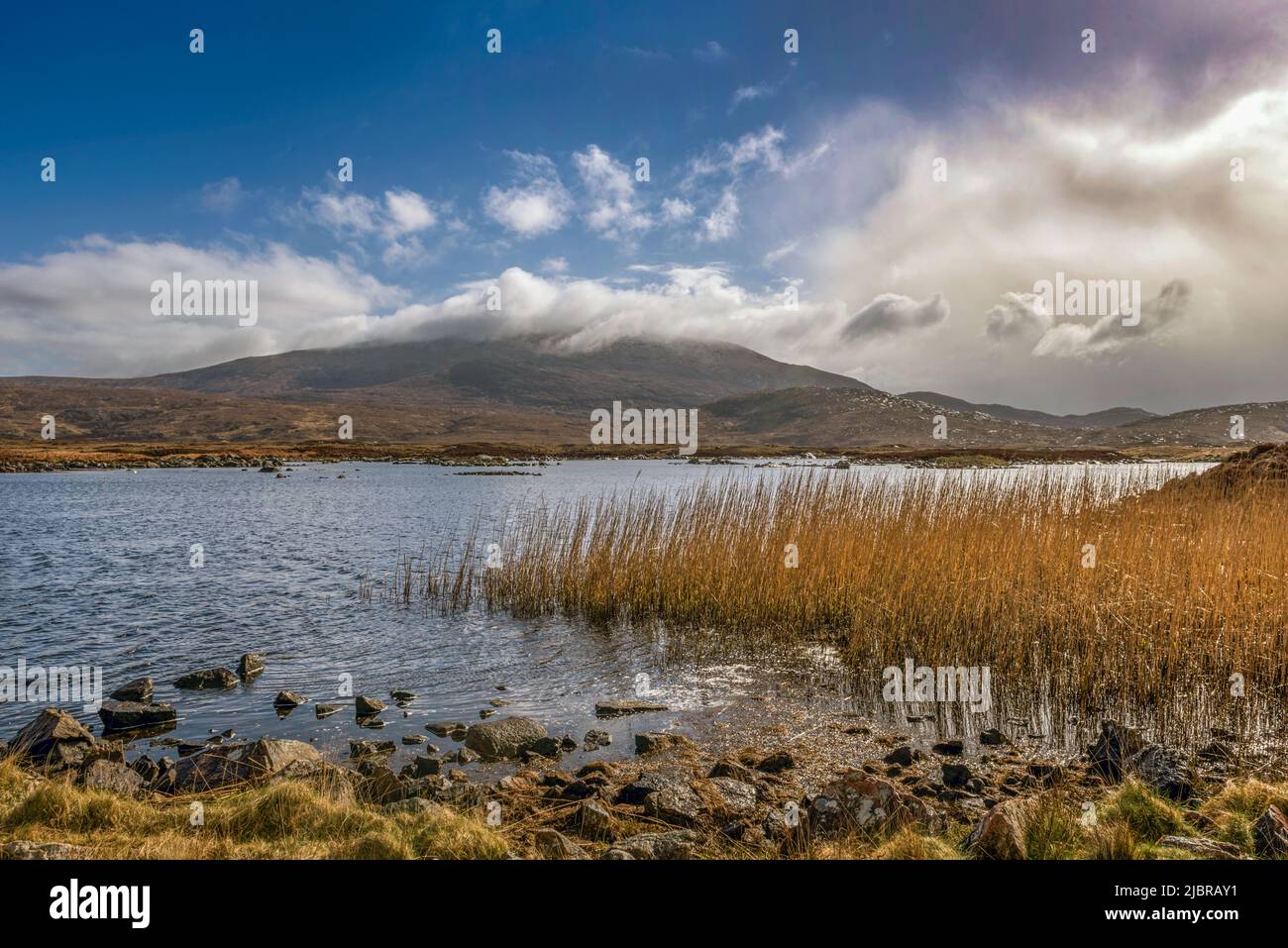 Ben More from Loch Cann a'Bhaigh on South Uist in the Outer hebrides ...