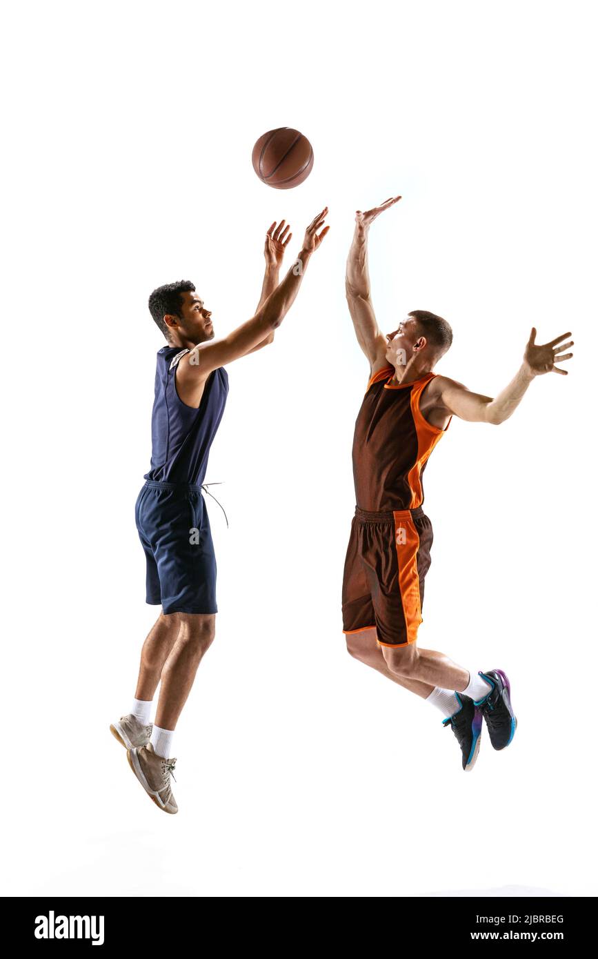 Full-length portrait of two young men, professional basketball players ...