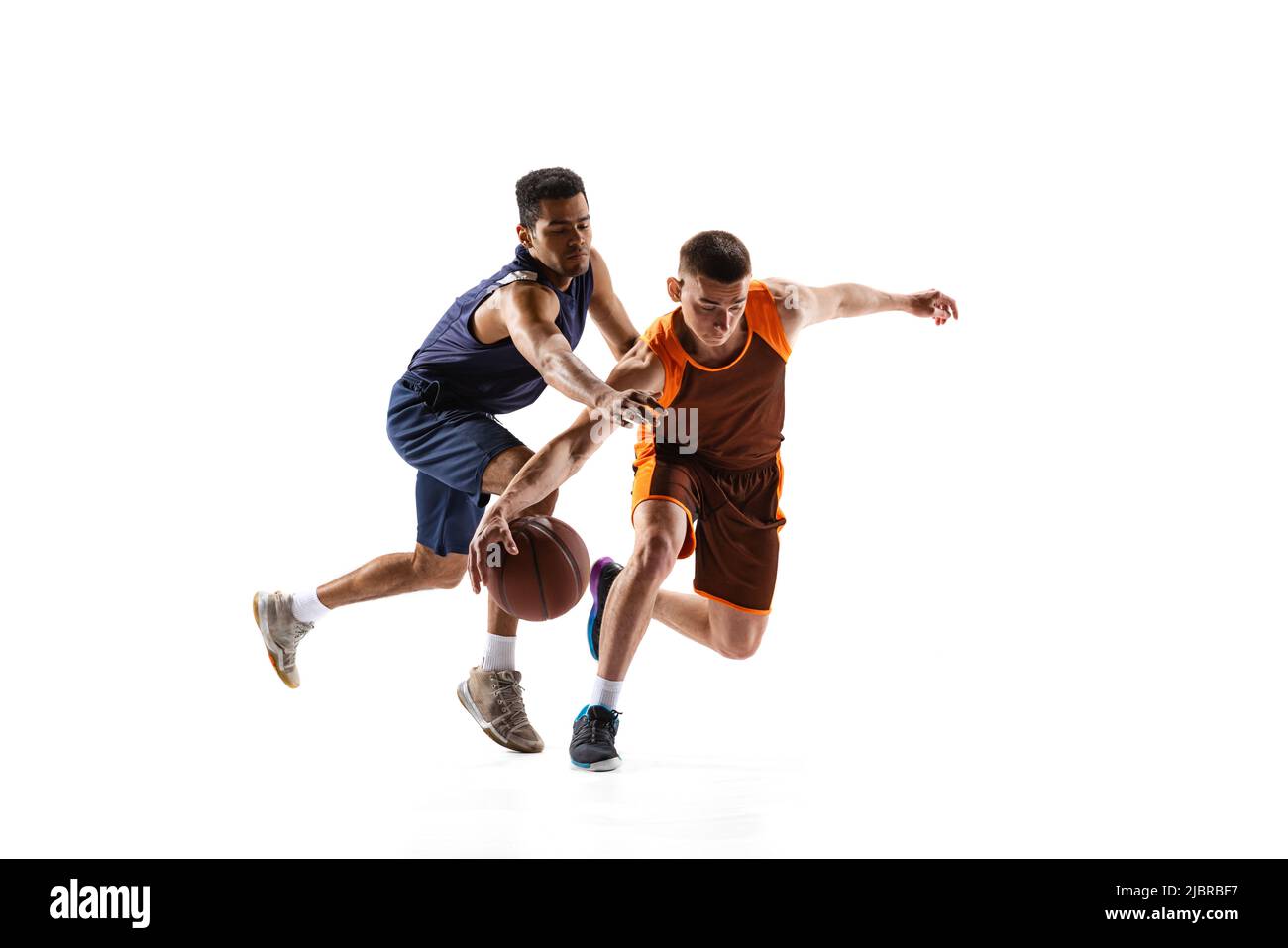 Portrait of two basketball players in motion, training, playing ...