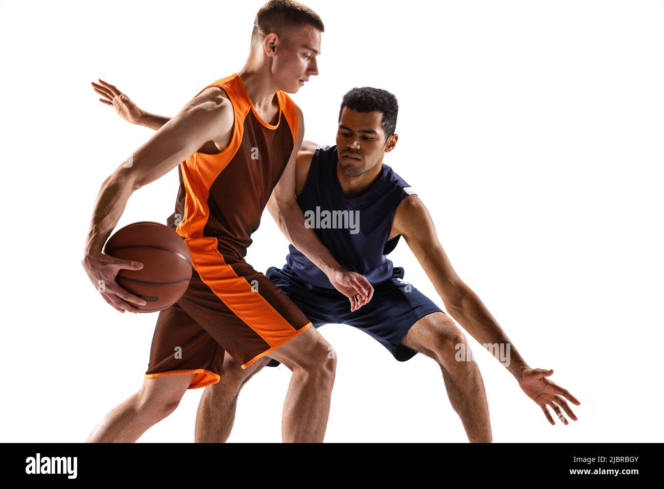 Portrait of two young men, basketball players in uniform training ...