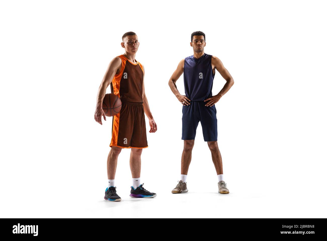 Full-length portrait of two young men, professional basketball players ...