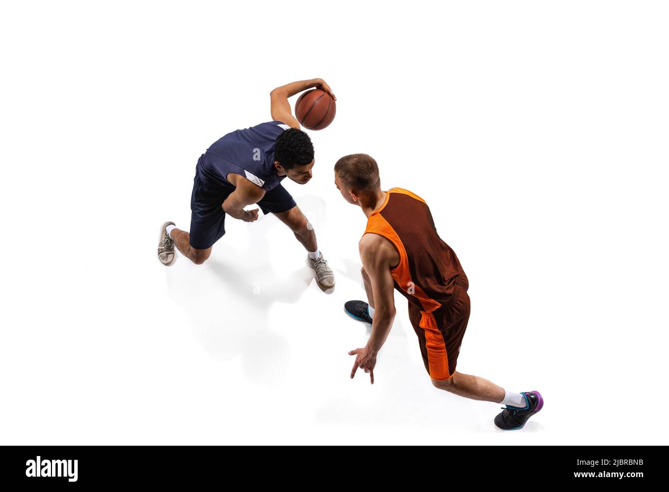 Top view portrait of two men, professional basketball players in motion ...