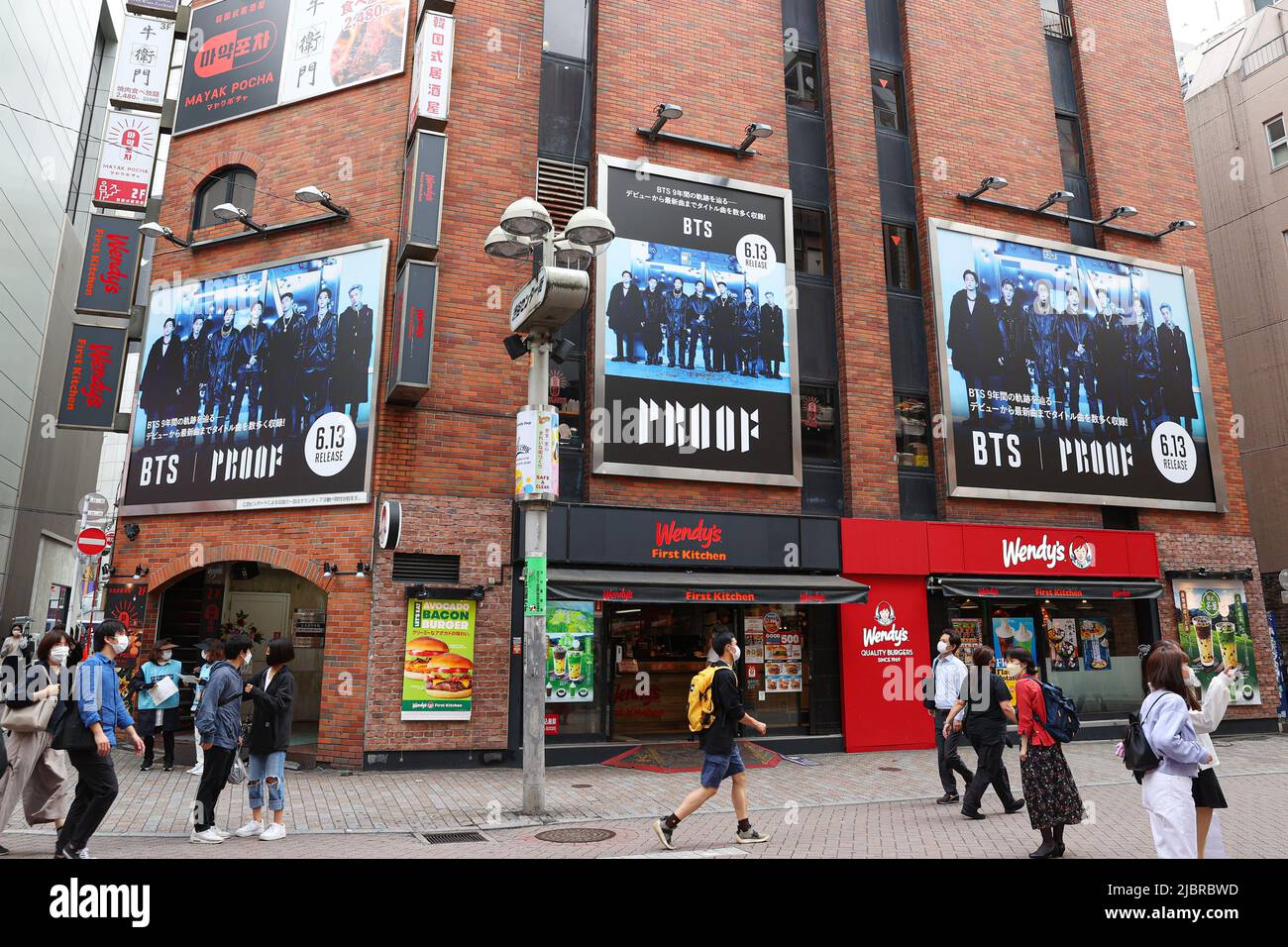 A billboard of South Korean boy band BTS is seen at Shibuya shopping ...