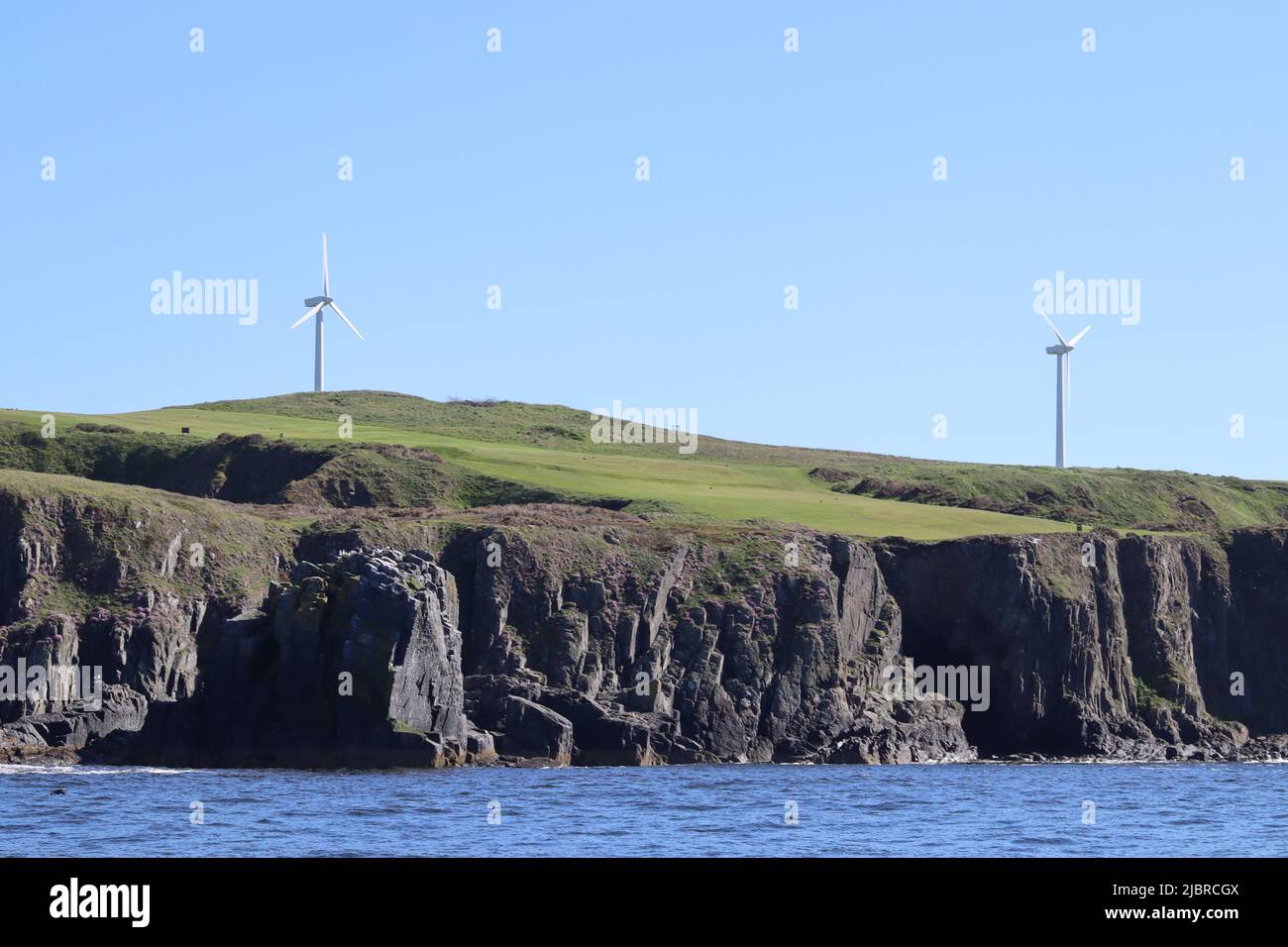 Wind turbine on cliffs Stock Photo - Alamy