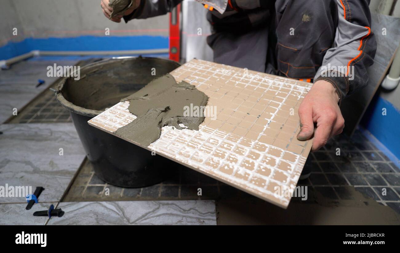 Applying tiles hi-res stock photography and images - Alamy