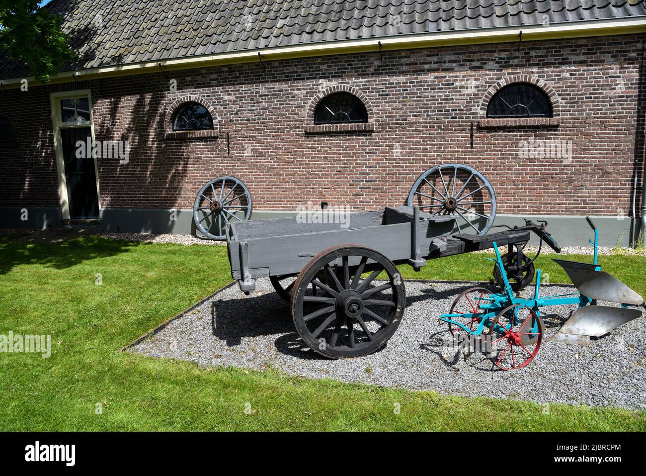 Beemster, Netherlands, May 2022. A traditional farm with old agricultural tools. High quality ...