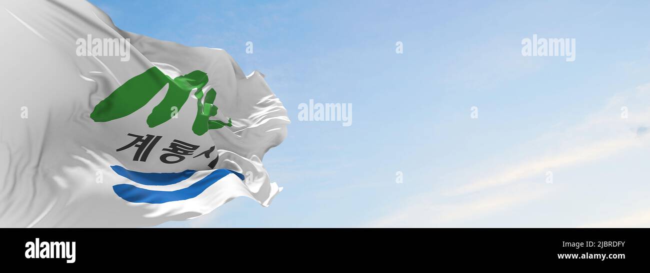 official flag of Gyeryong city, South Korea at cloudy sky background on ...