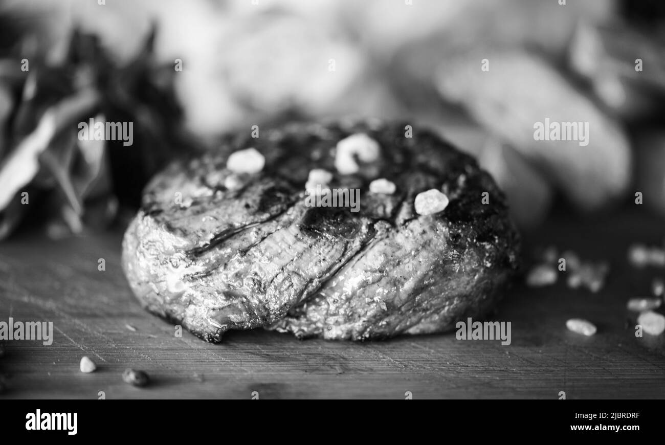 Closeup grilled steak on grill Black and White Stock Photos & Images ...