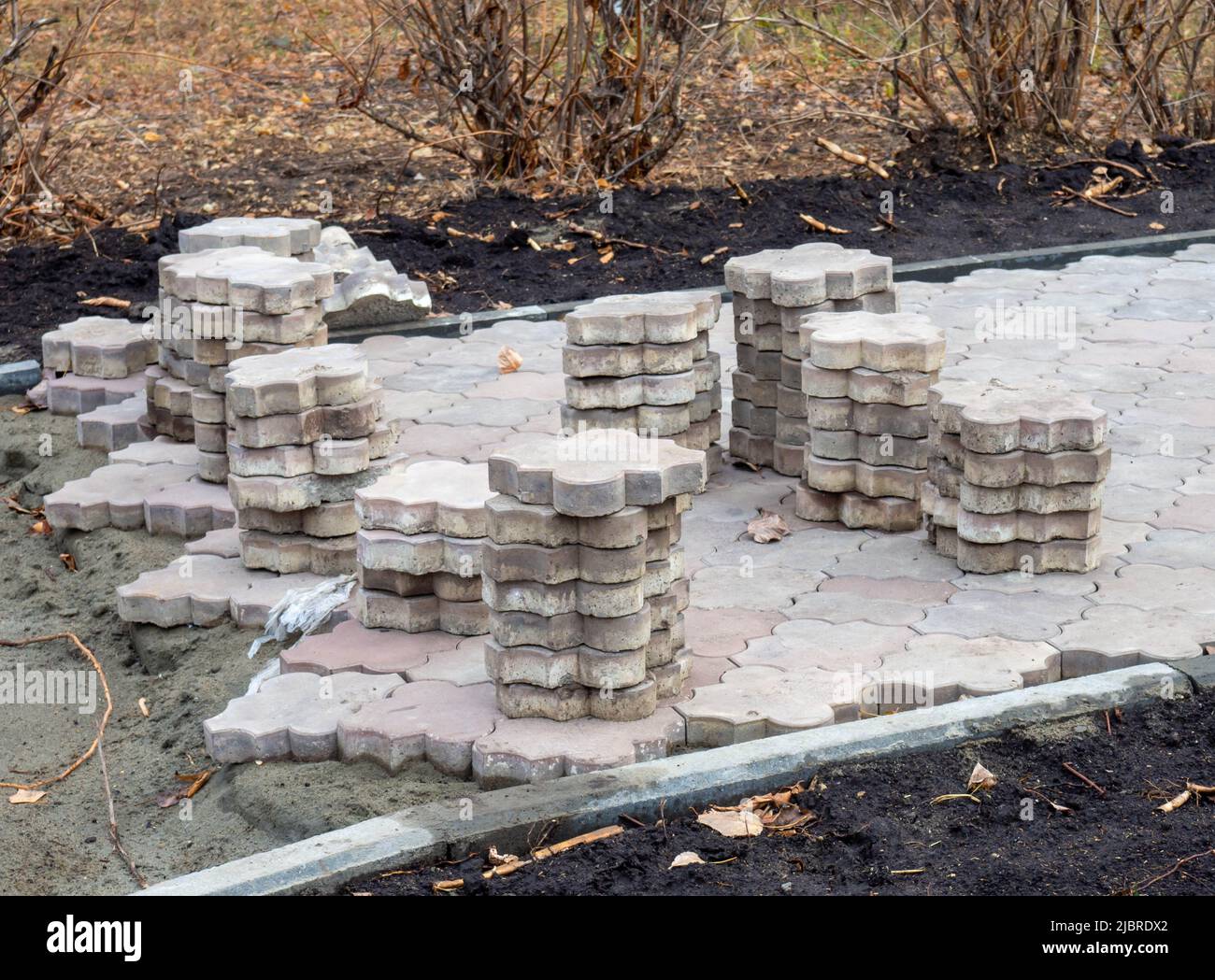 Laying paving slabs on the street. The working process Stock Photo - Alamy