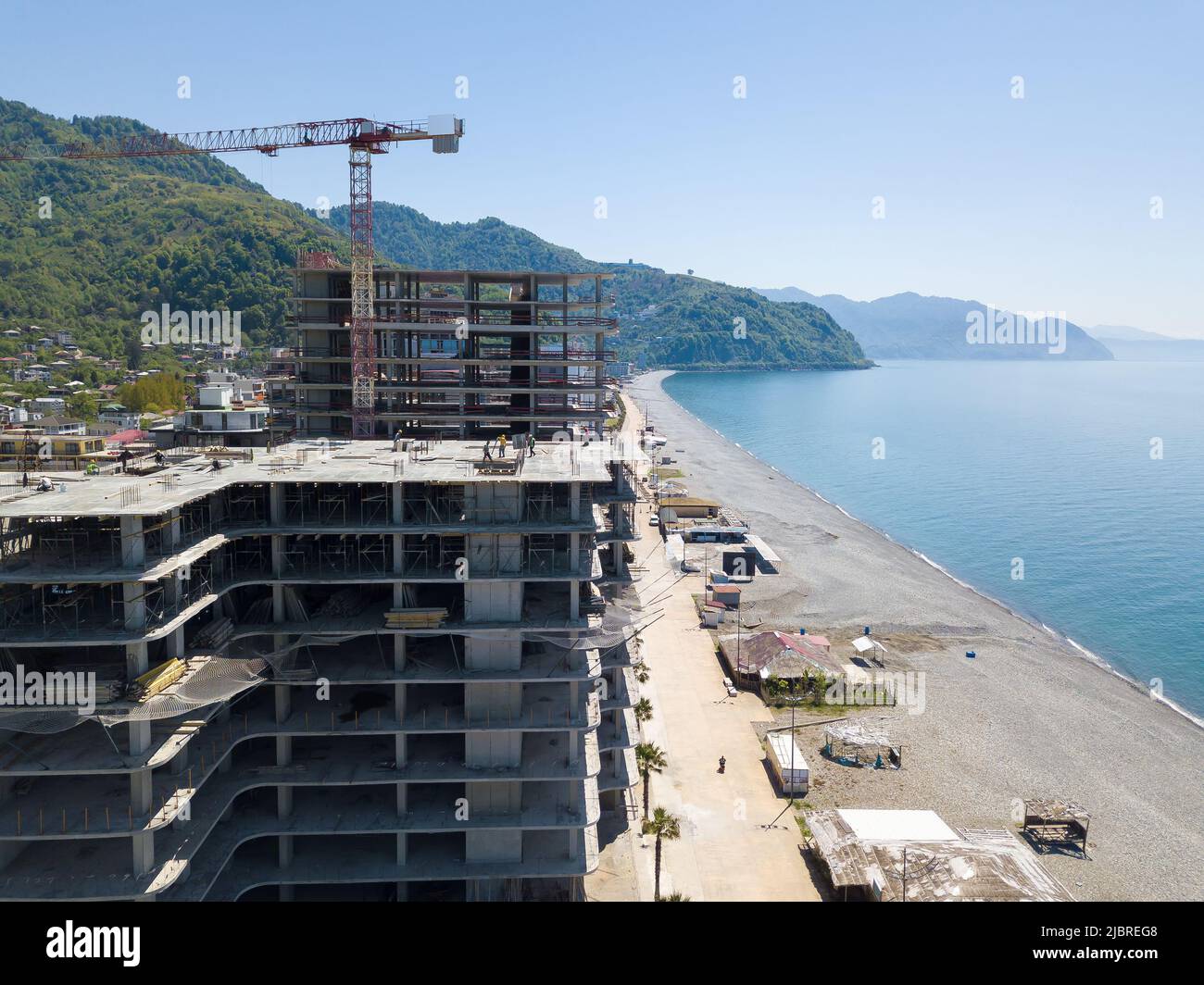 Drone view of the construction of multi-storey buildings on a summer ...