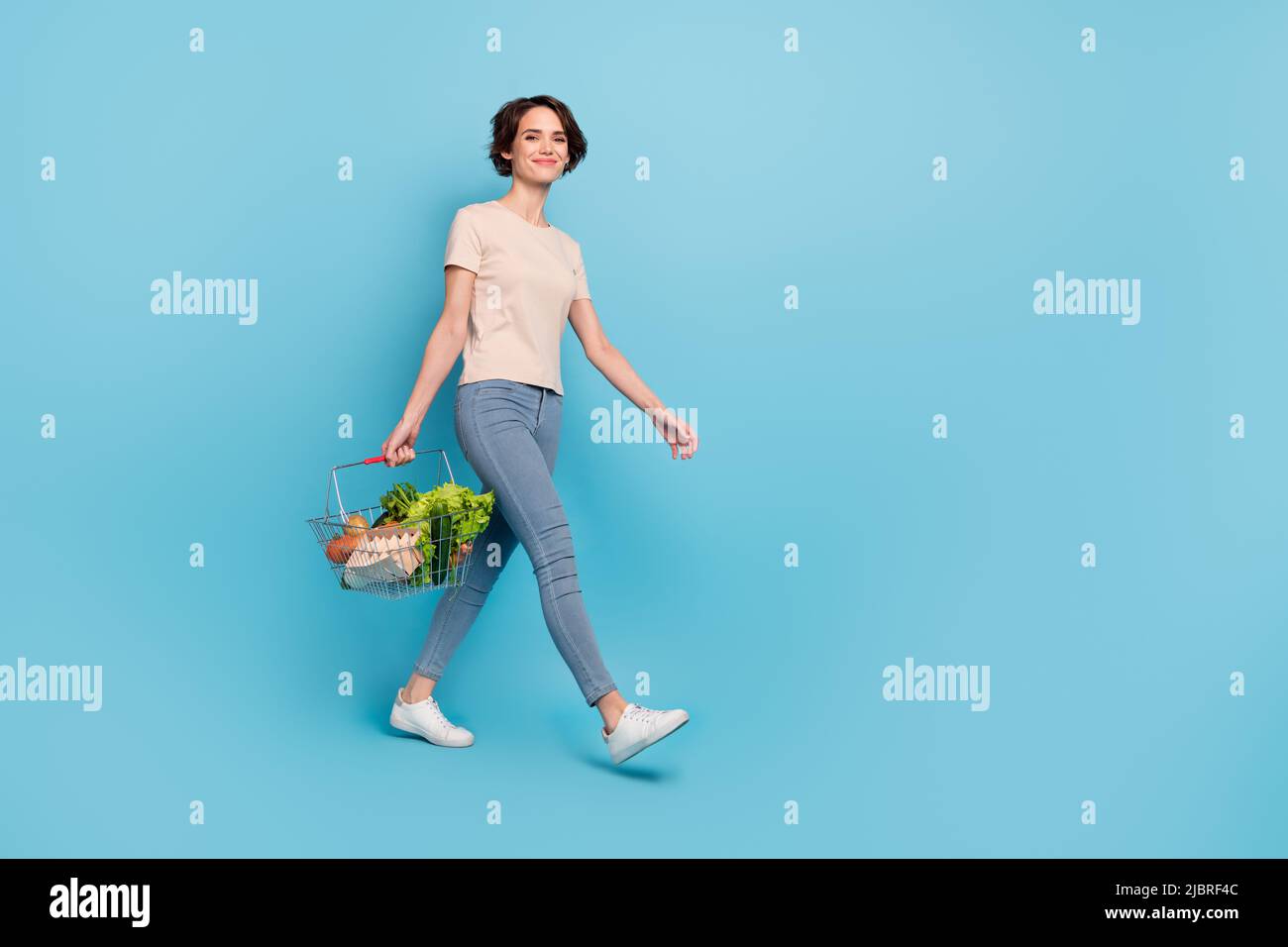 Full size photo of young lovely woman go shopping visit grocery store ...