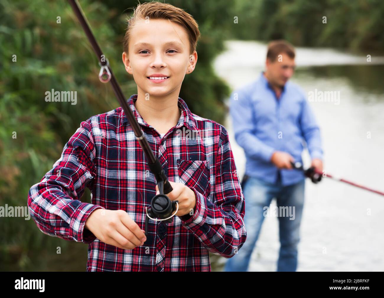 Boy with fishing tackle hi-res stock photography and images - Alamy