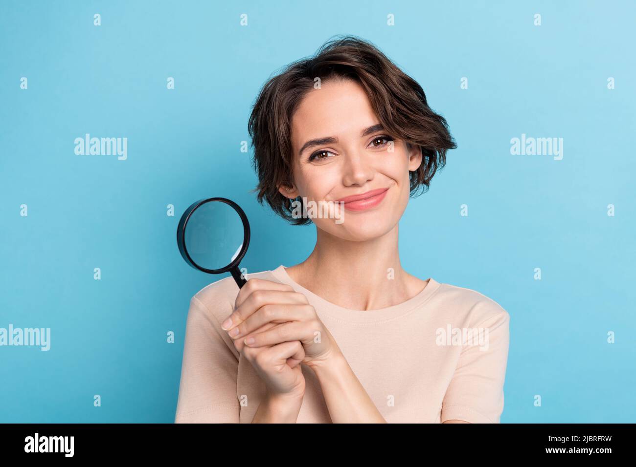 Photo of cute smart young lady working as detective find clues with ...