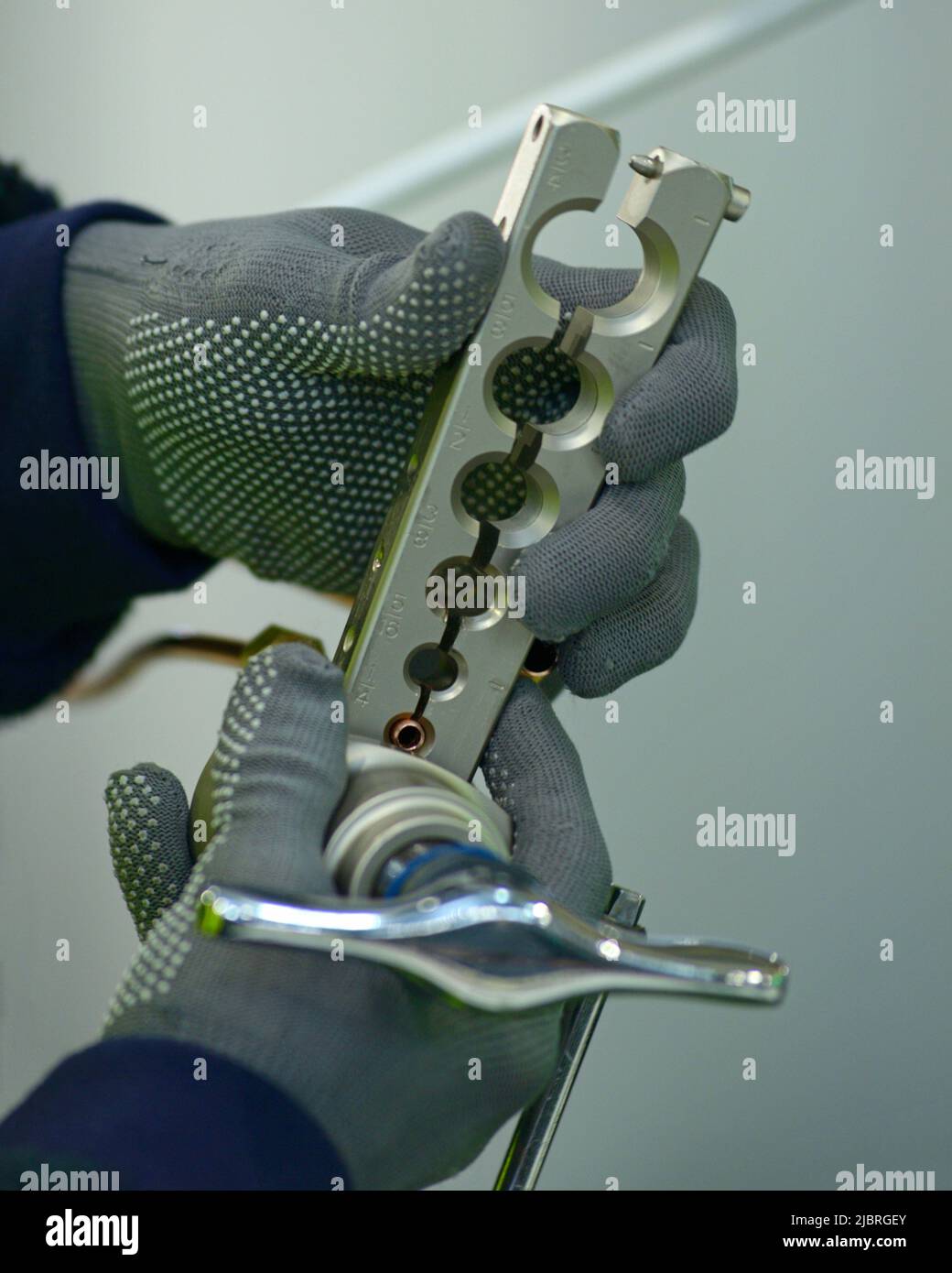 Worker hands fitting clamps for cables of an air conditioner Stock ...