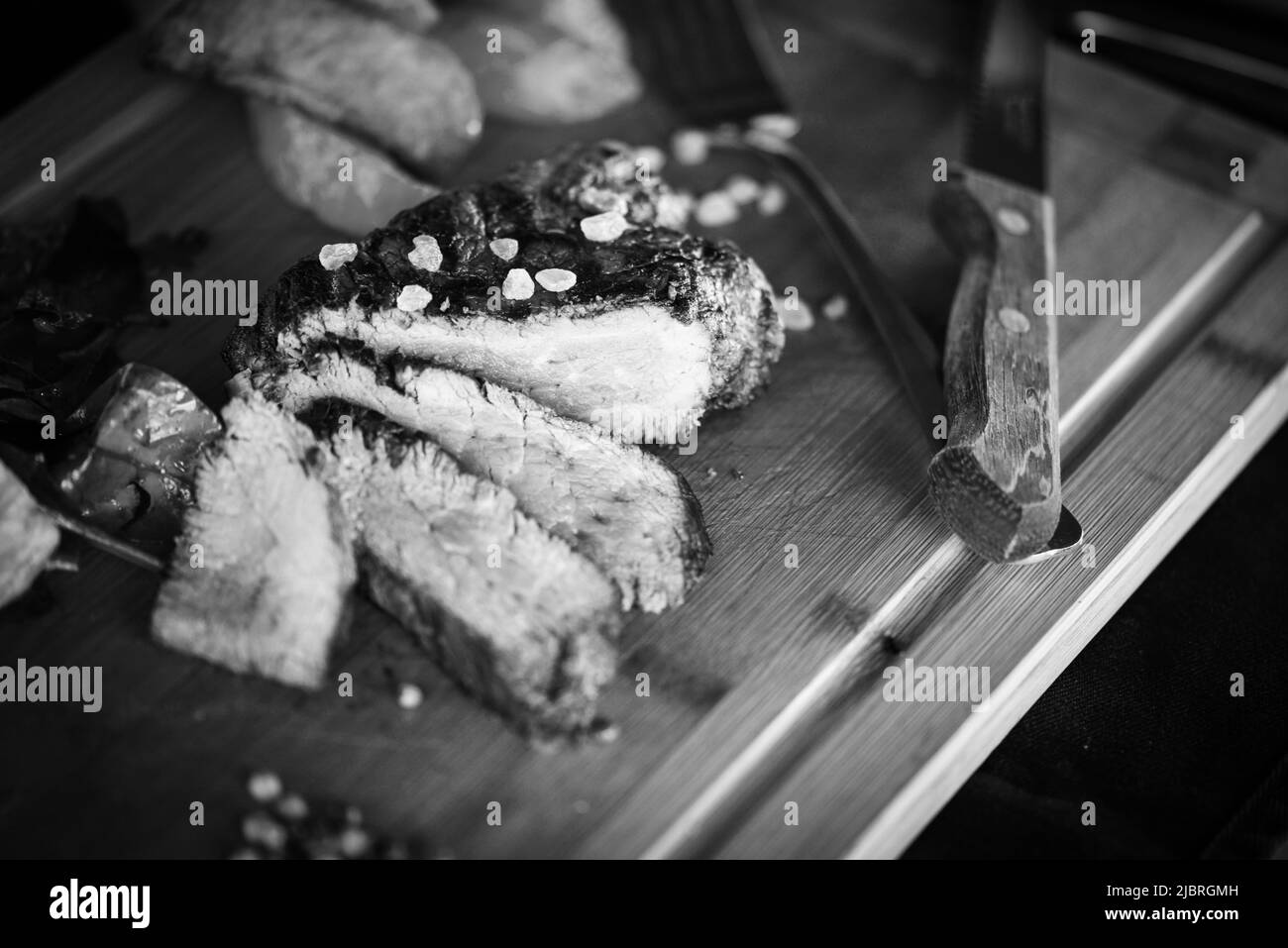 Closeup grilled steak on grill Black and White Stock Photos & Images ...