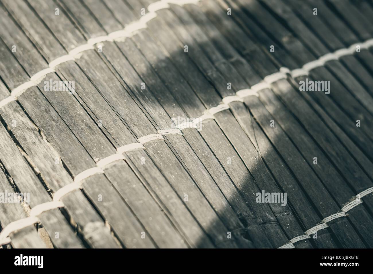 Old woven bamboo rug, rough texture dirty, fragment banner. Diagonal ...