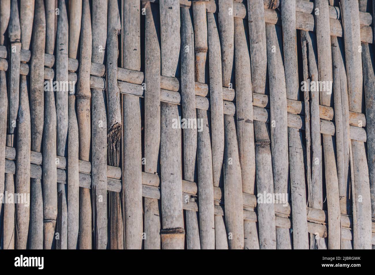 Old woven bamboo rug, rough texture dirty, fragment banner. Diagonal ...