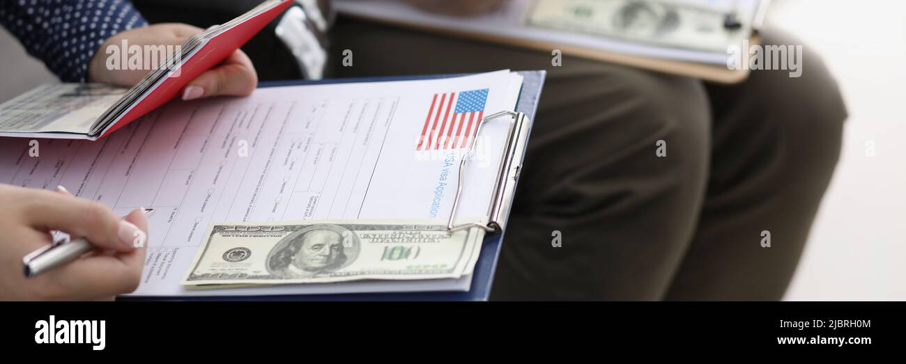 Men sit in line and filling visa application forms to get access to ...