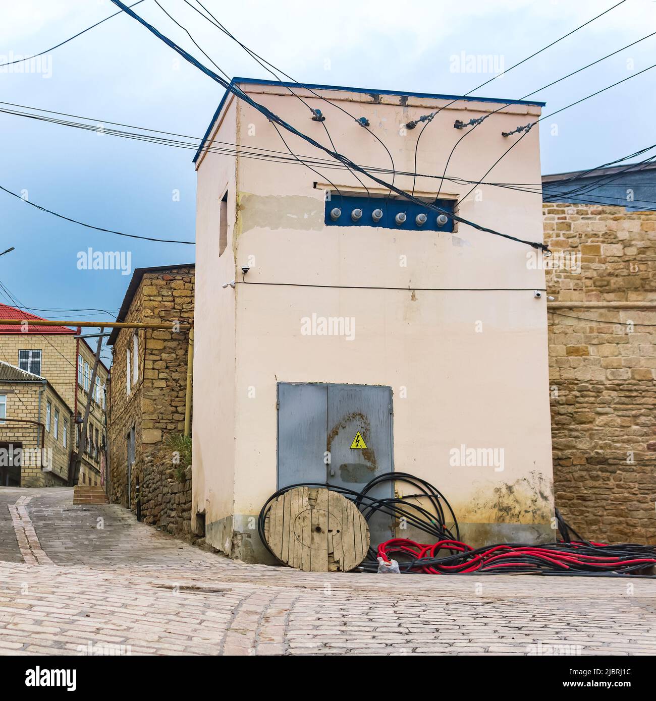 repair of a transformer box in a historic area with old houses Stock ...
