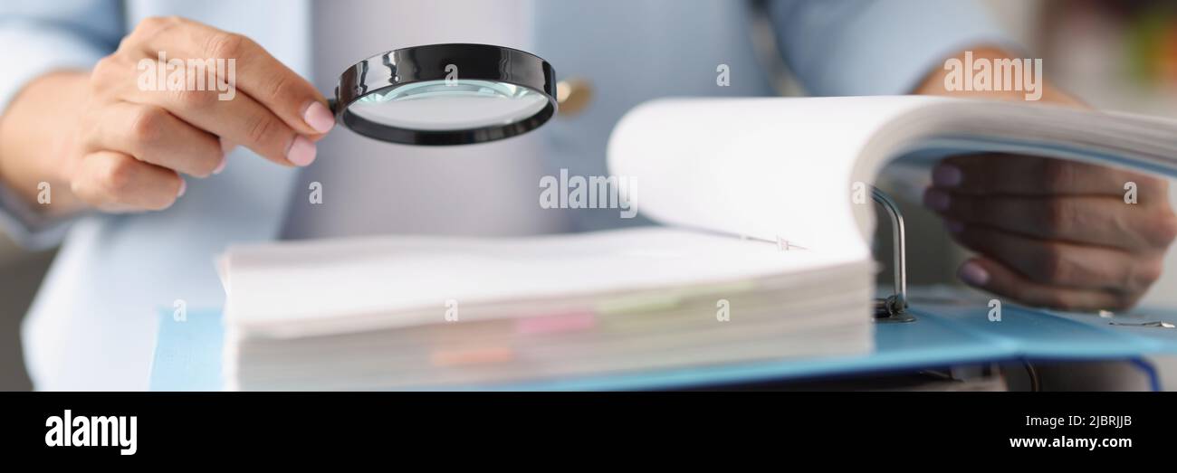 Businesswoman looking through magnifying glass hi-res stock photography ...