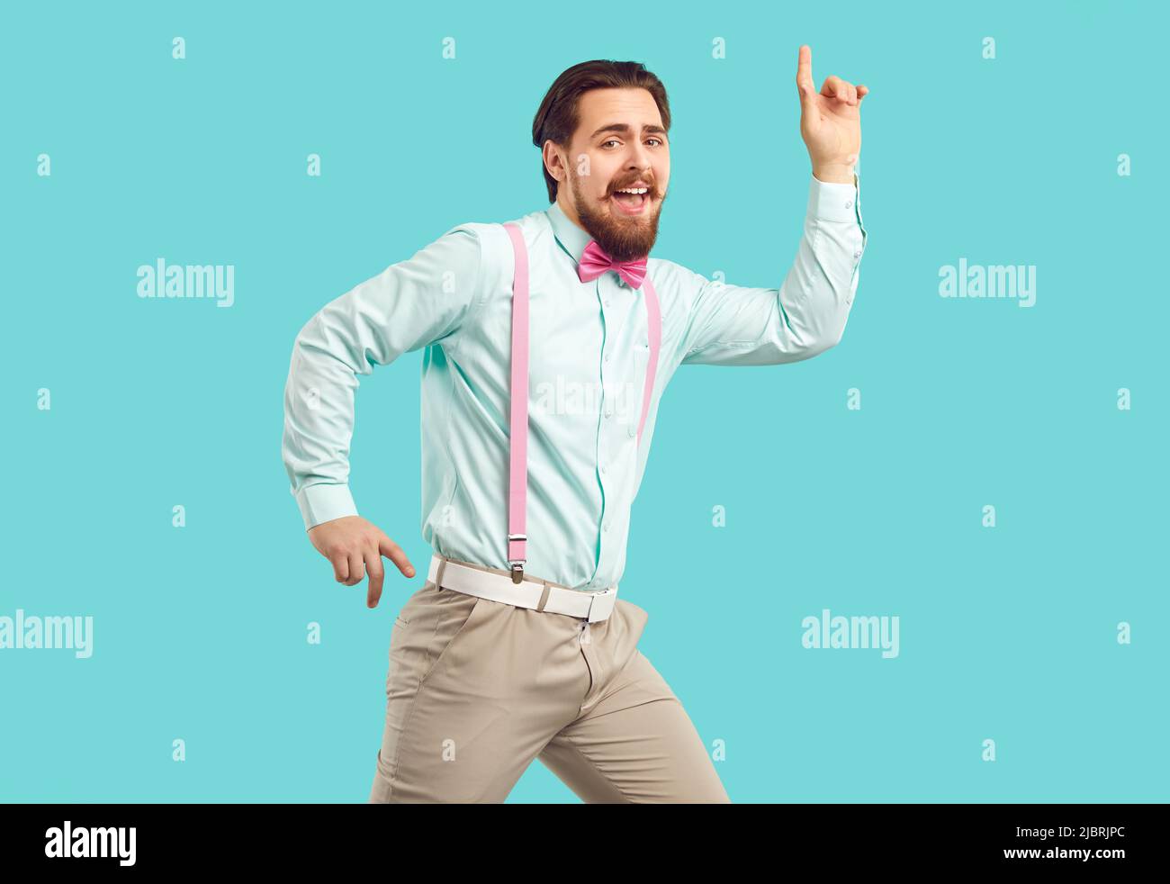 Funny man have fun dancing on studio background Stock Photo - Alamy
