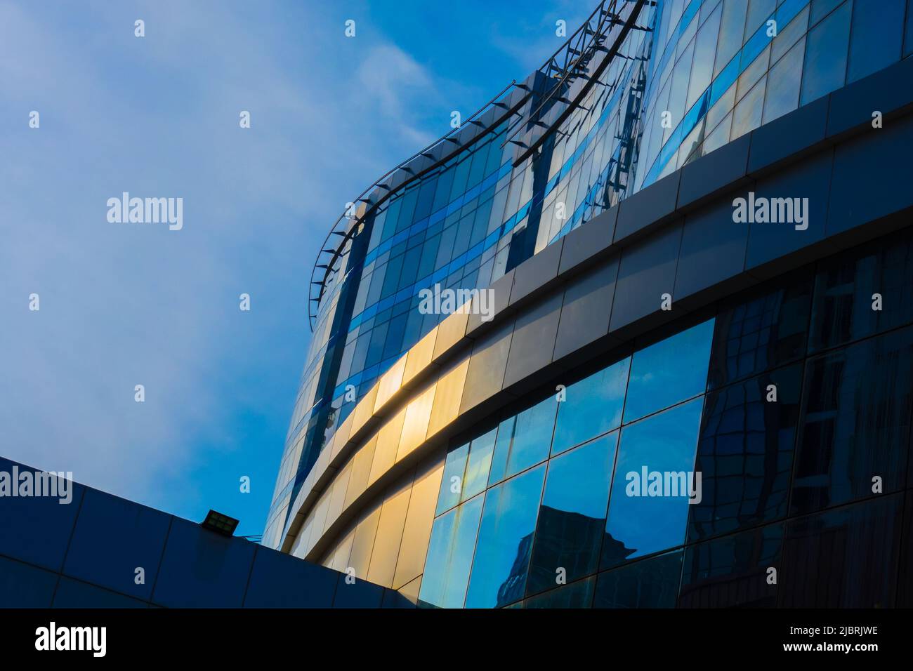 Modern glass building with sunlit walls Stock Photo - Alamy