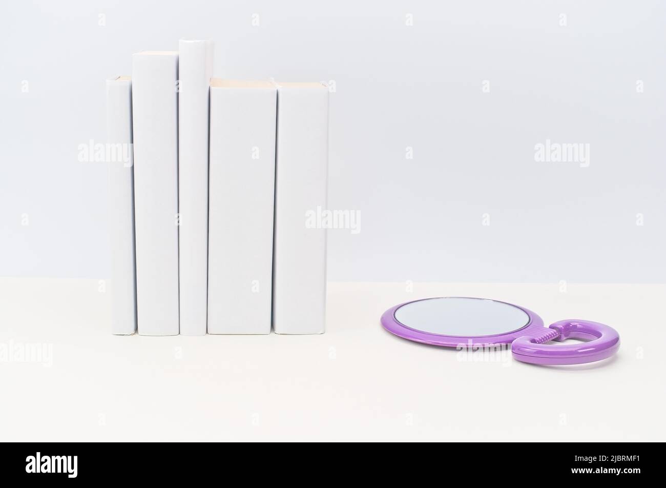 round table mirror with plastic frame on a soft beige desk Stock Photo ...