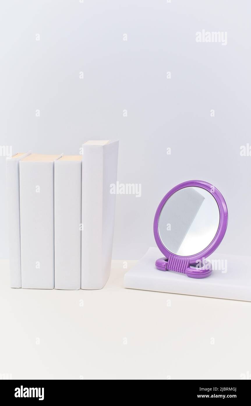 round table mirror with plastic frame on a soft beige desk Stock Photo ...