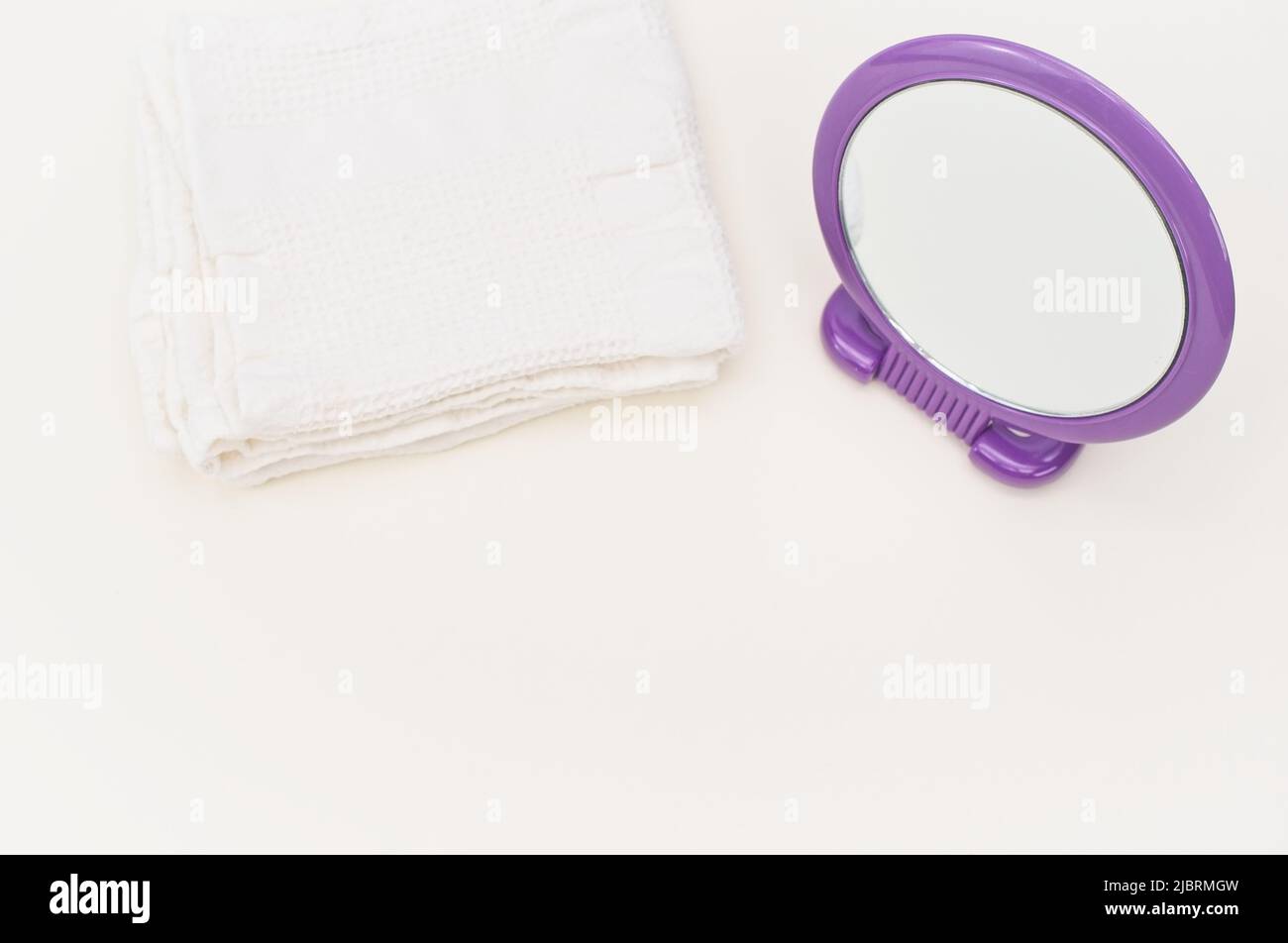 round table mirror with plastic frame on a soft beige desk Stock Photo ...